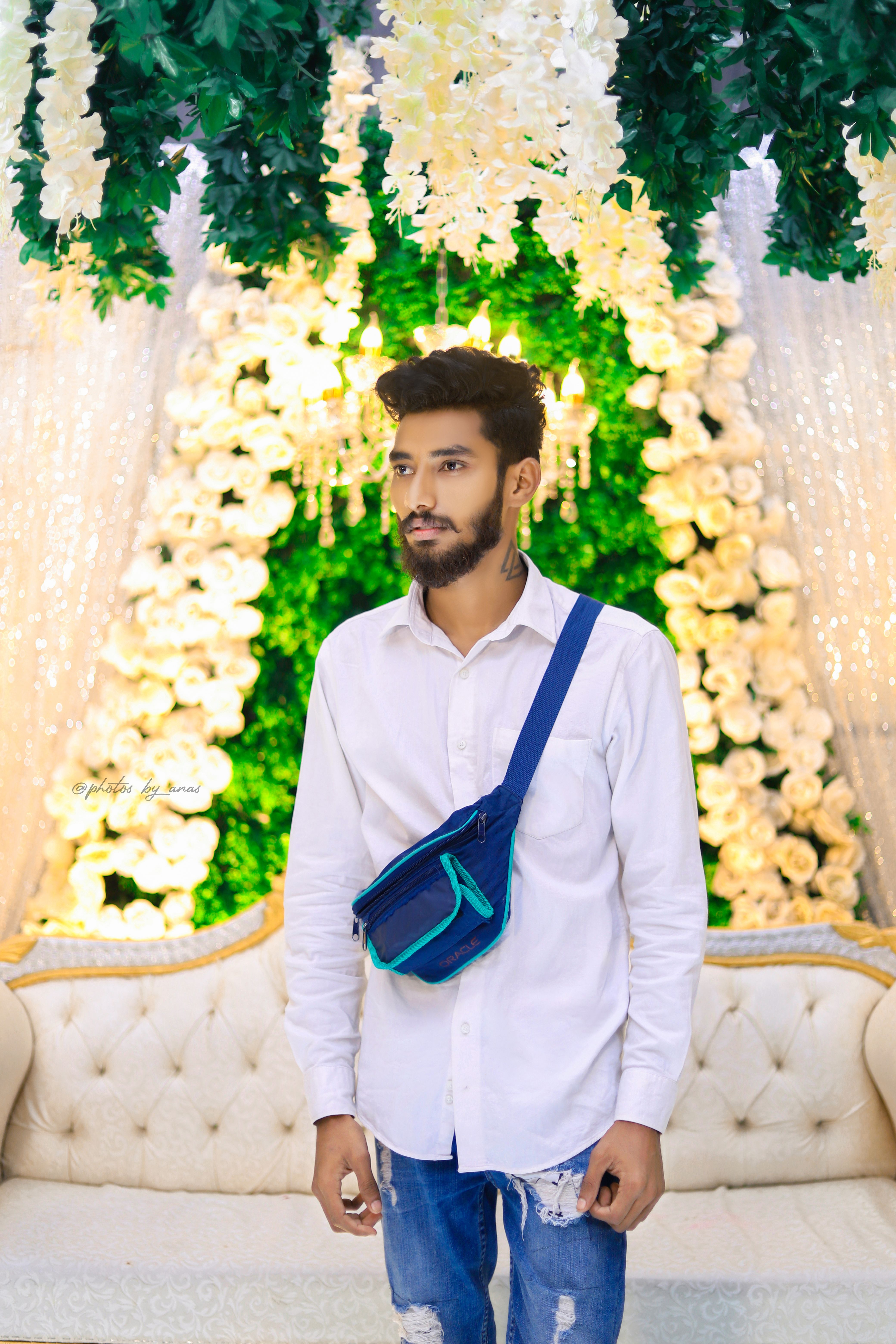 Man Posing by Wall · Free Stock Photo