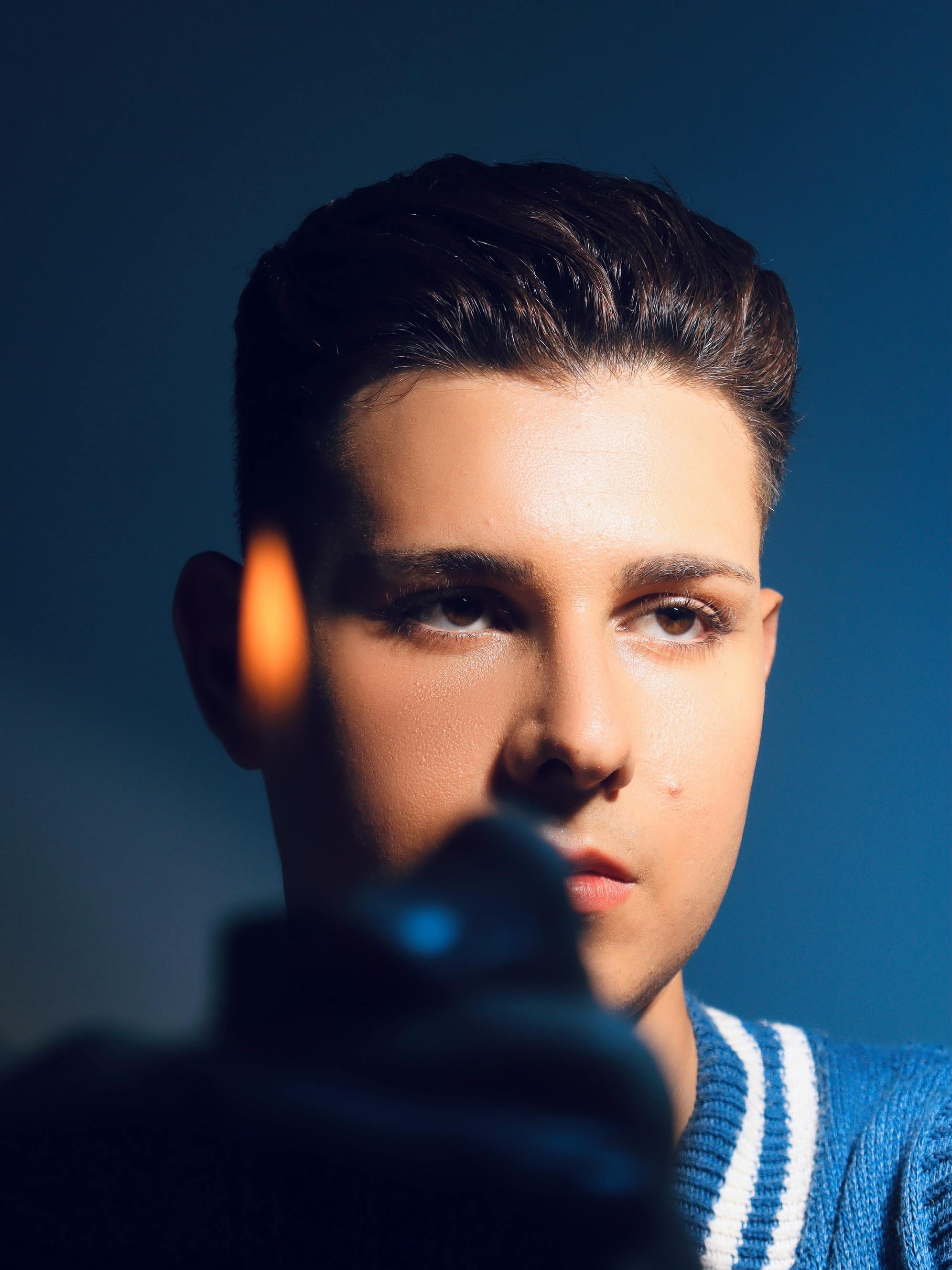 Woman Holding a Lit Lighter in Front of Her Face · Free Stock Photo