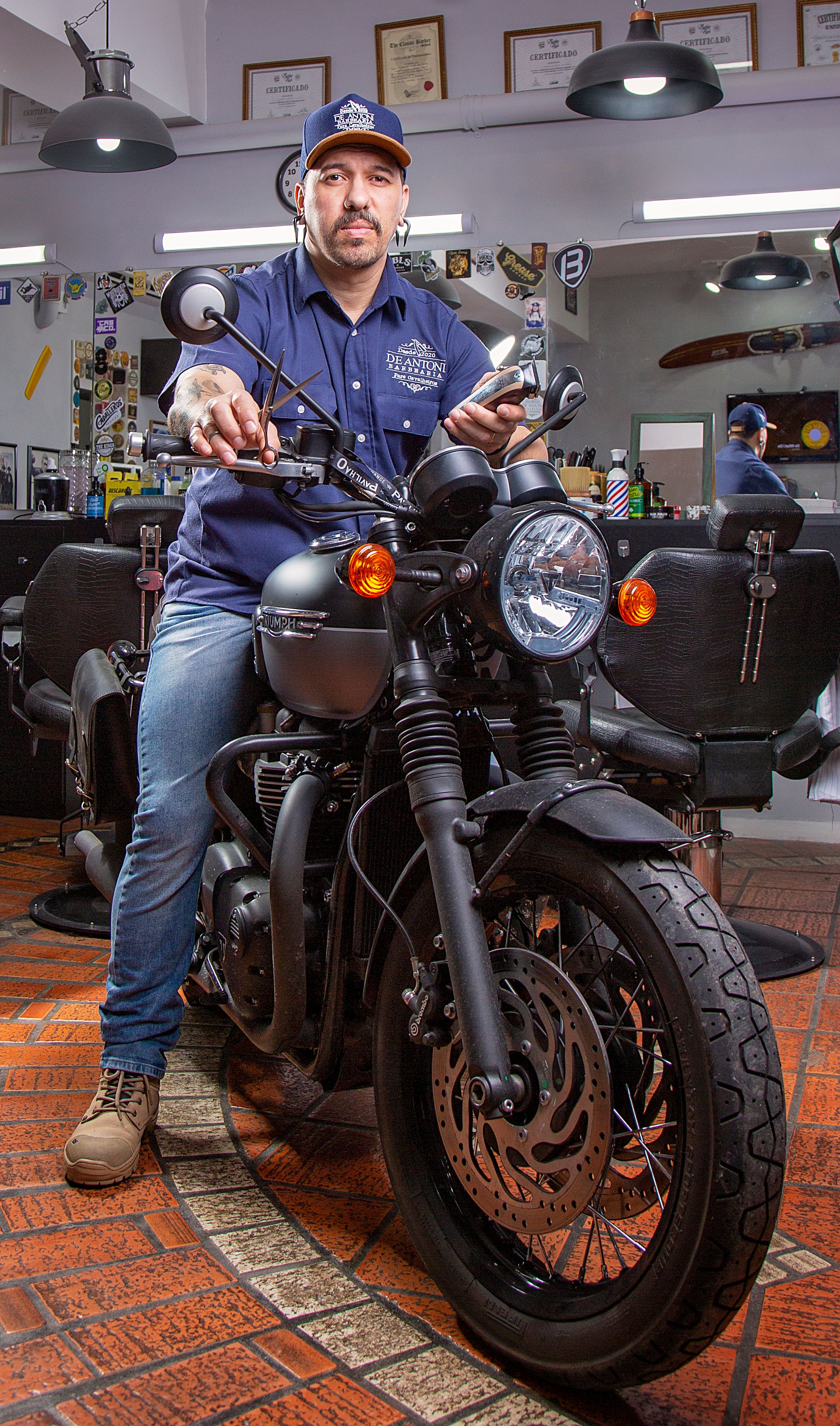 Man with Mustache Posing on Motorcycle in Hair Salon · Free Stock Photo