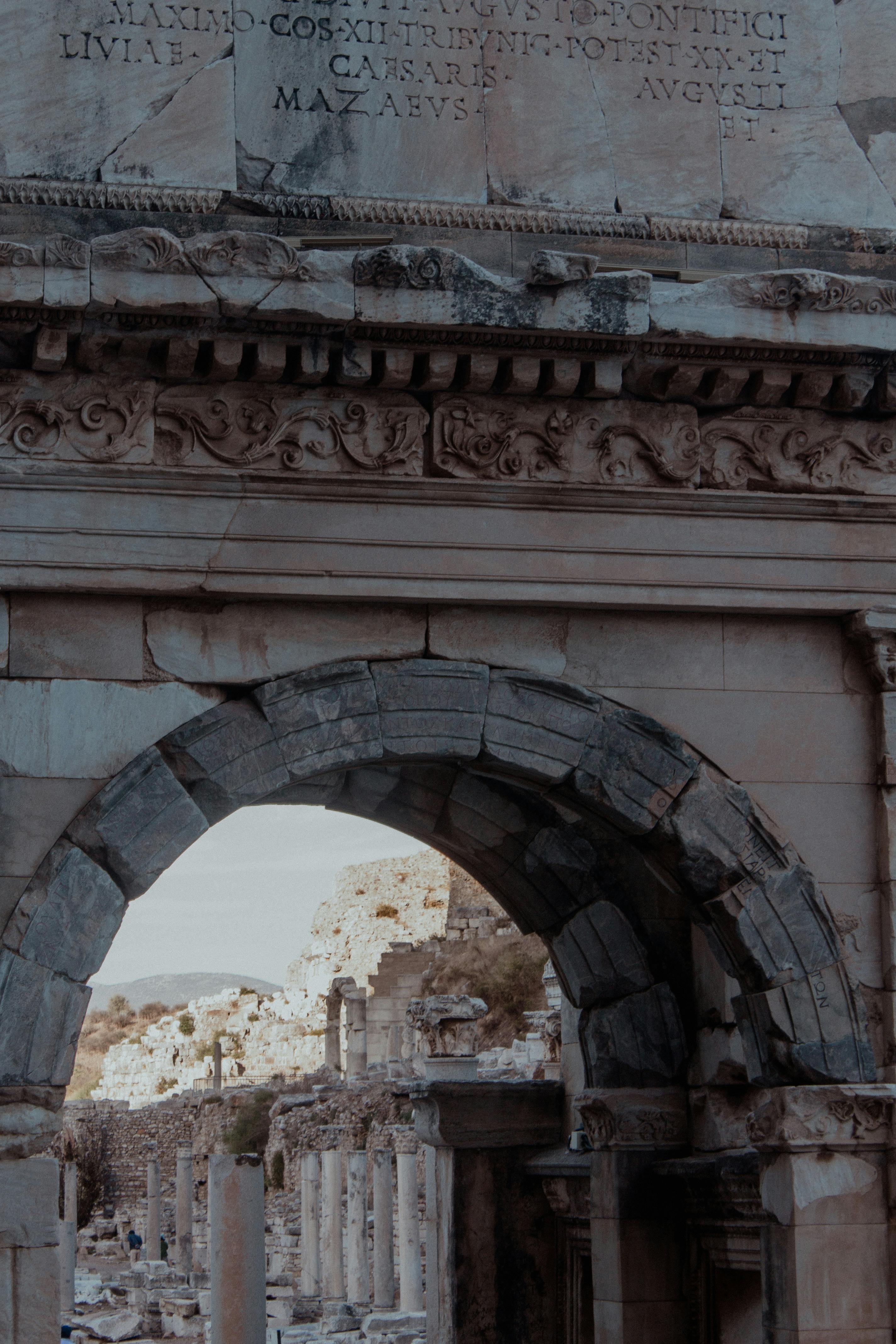 Man Standing in Front of an Arch in a Fortress · Free Stock Photo