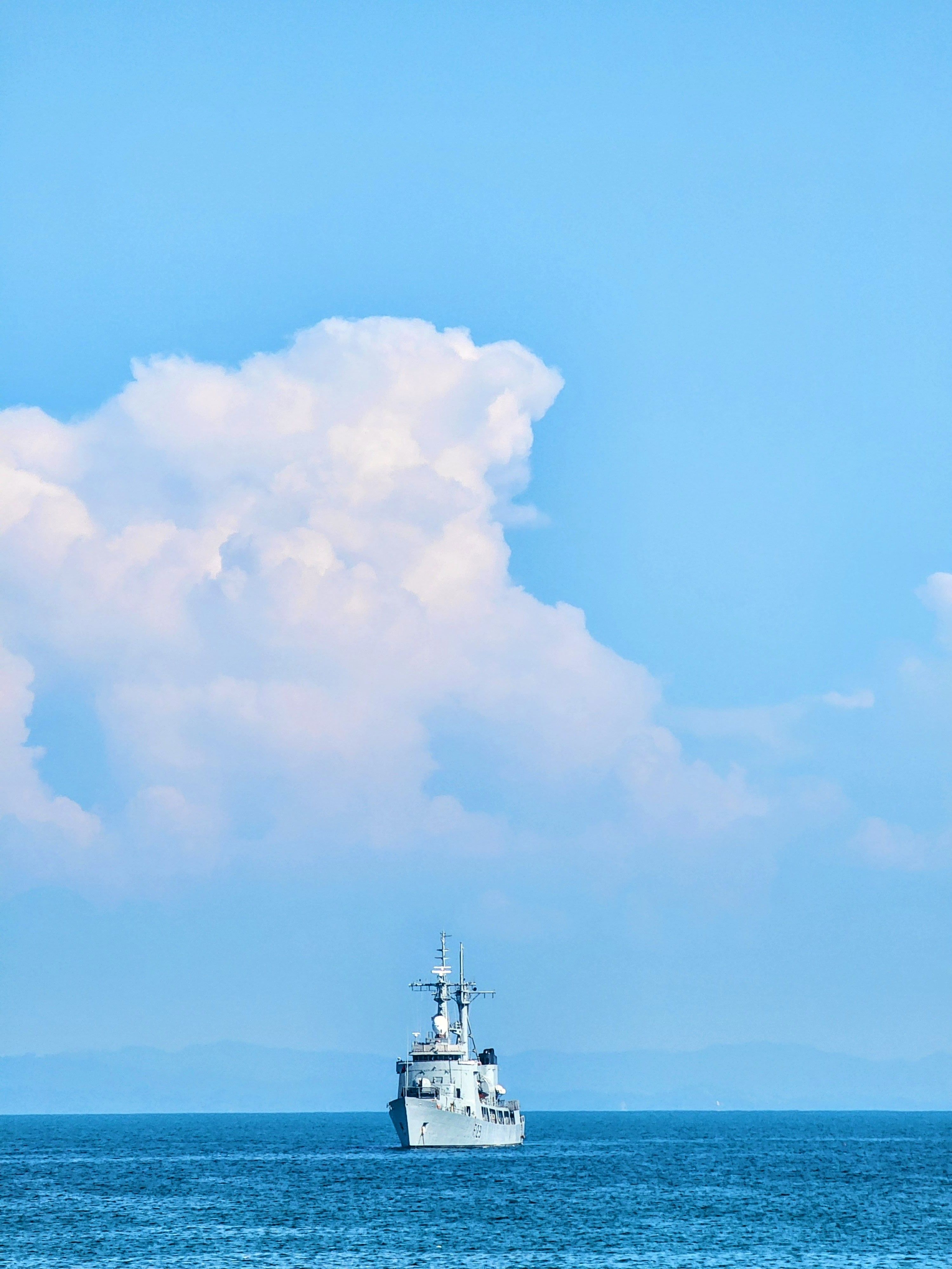 A Ship on the Sea in the Horizon under Blue Sky · Free Stock Photo