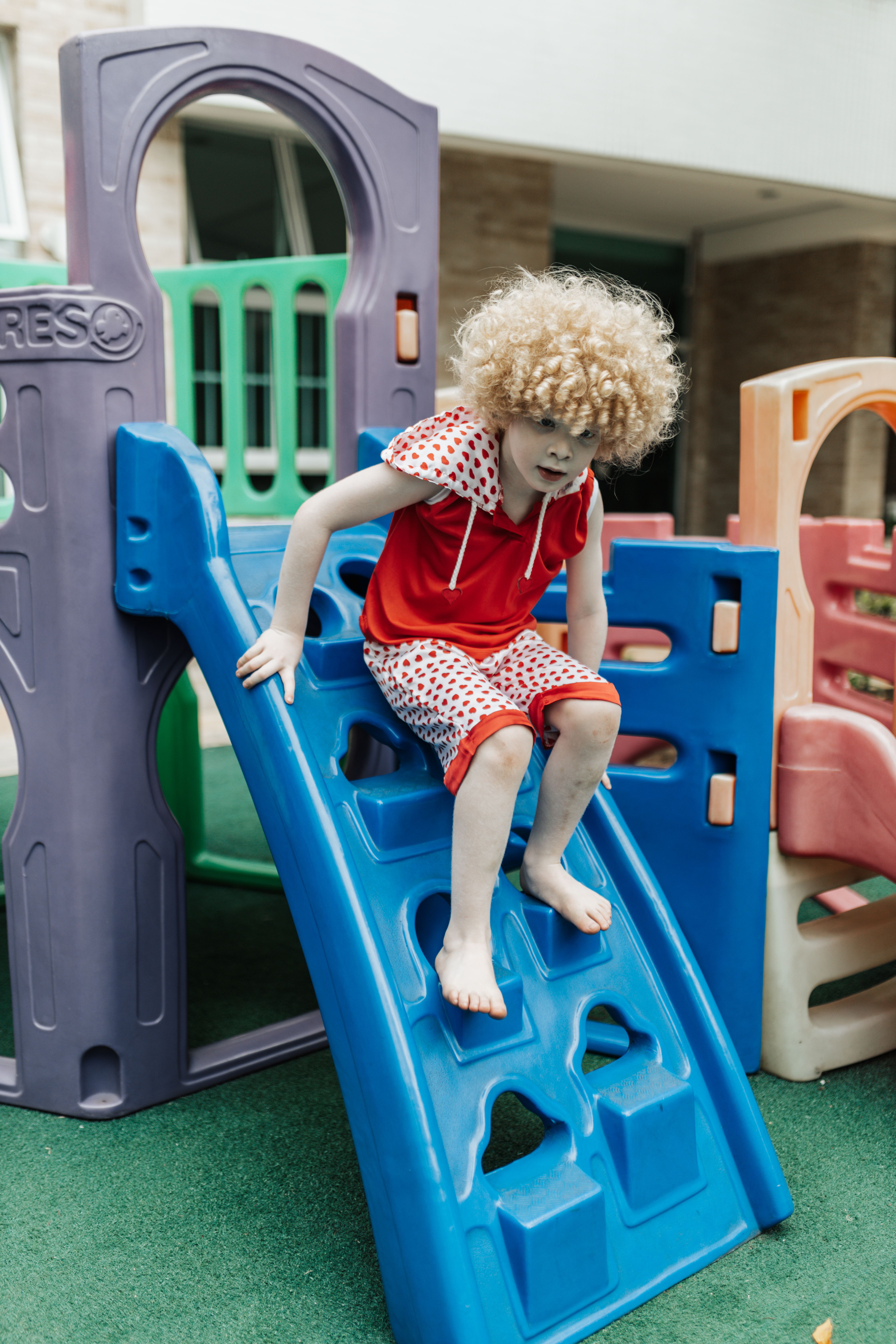 Blonde Boy in Red T-Shirt Playing on Slide · Free Stock Photo