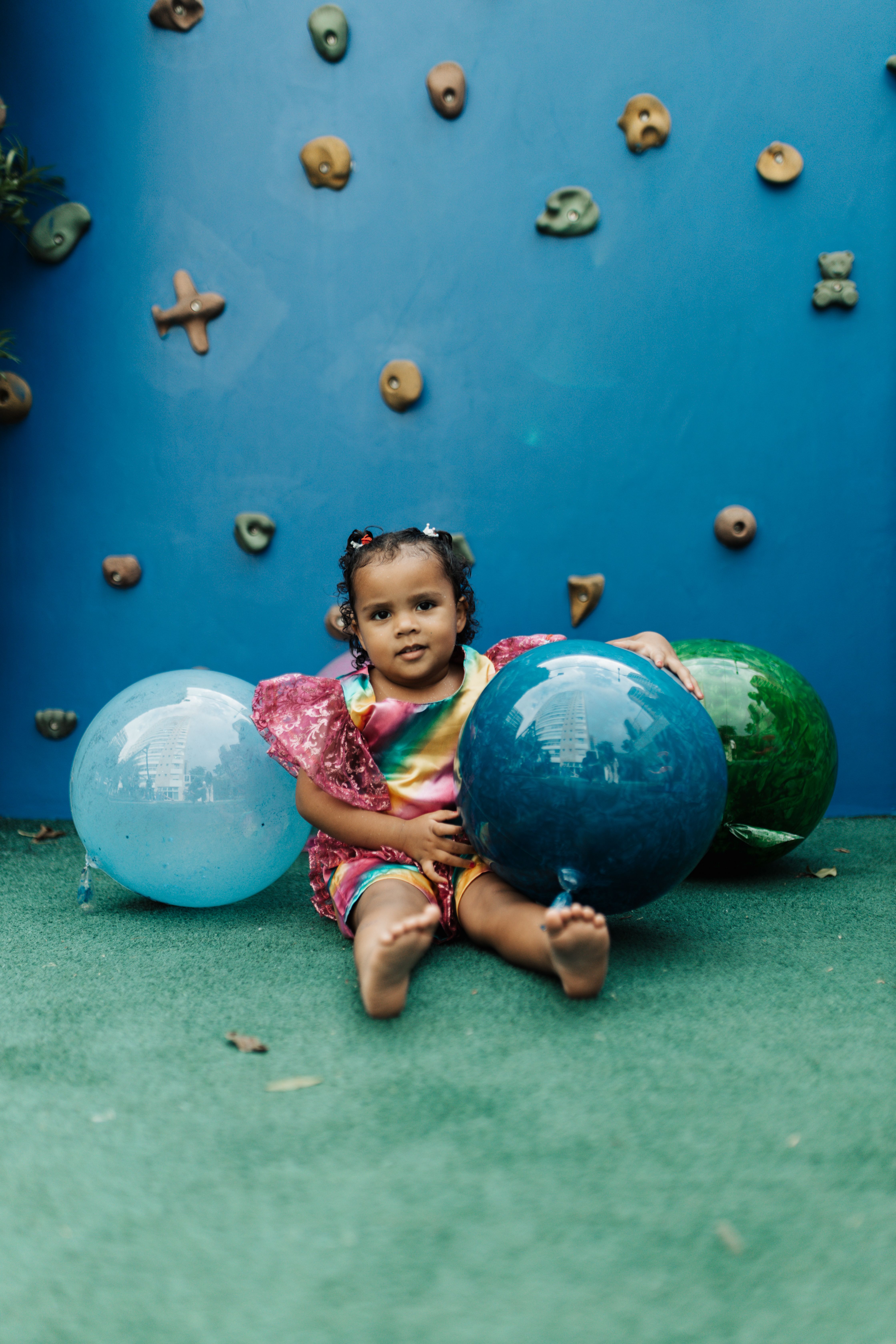 Girl Sitting with Balloons · Free Stock Photo