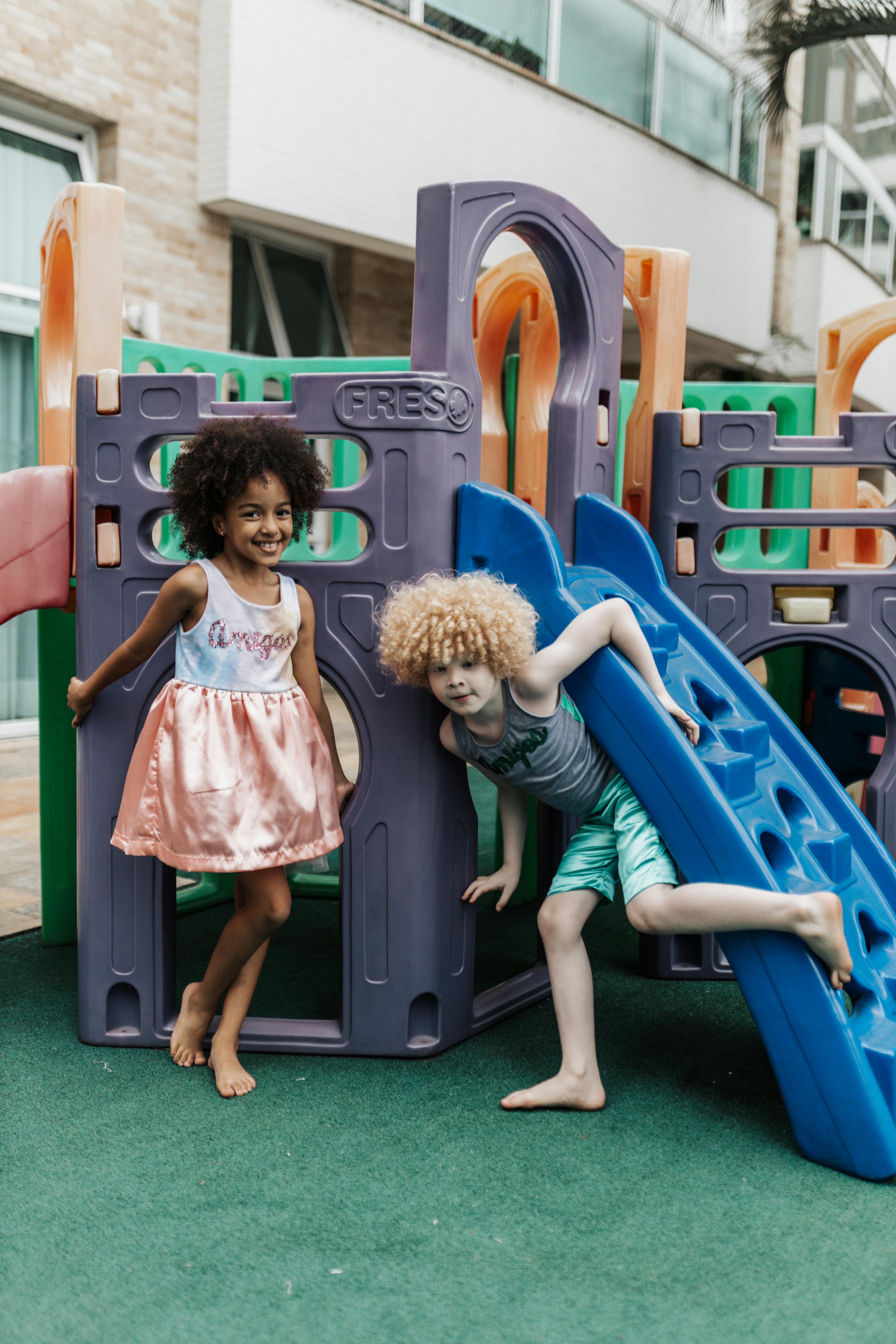 Young Boy And Girl Playing on a Playground · Free Stock Photo