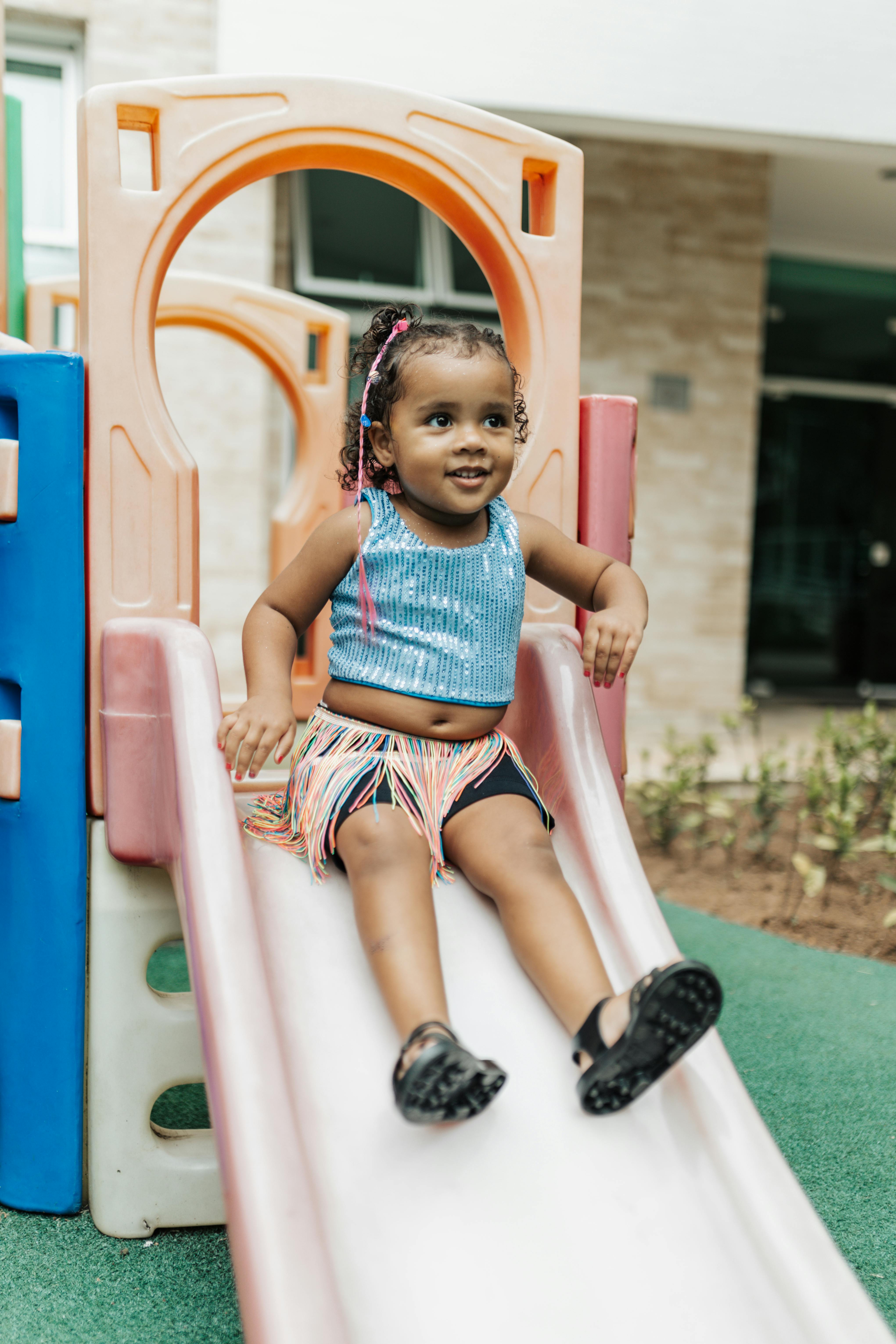 Smiling Child on Slide · Free Stock Photo