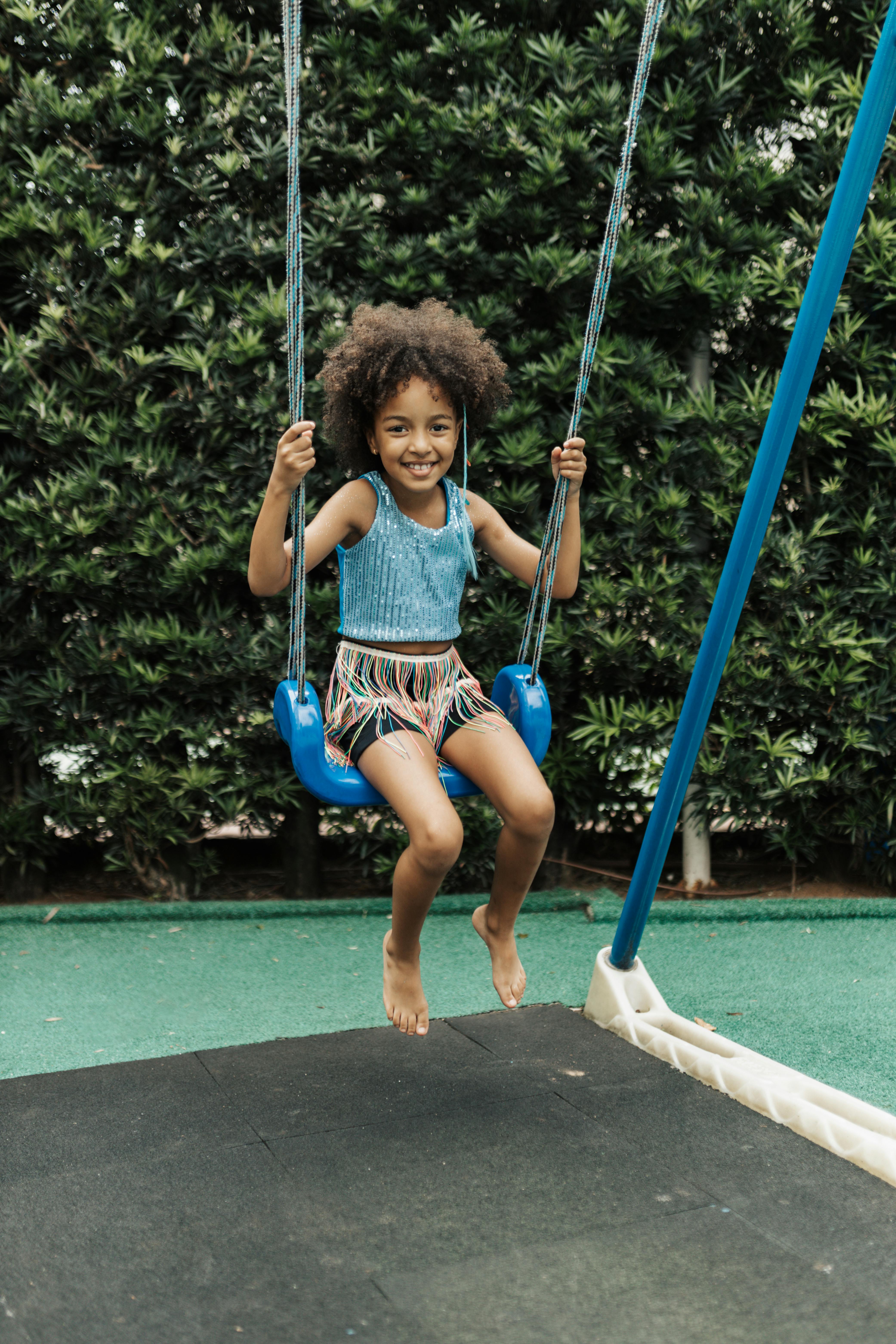 Pretty Girl on a Swing · Free Stock Photo
