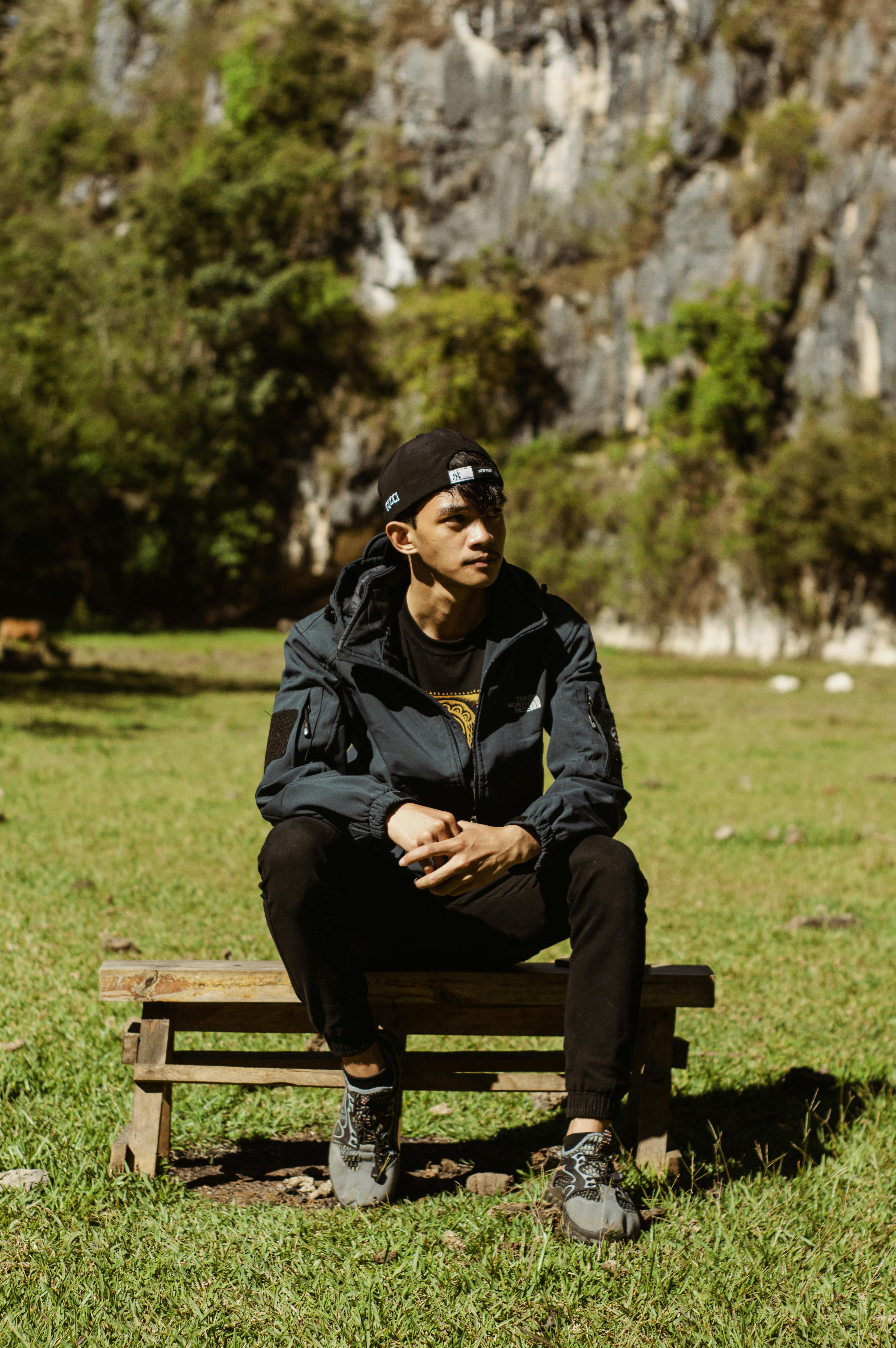Young Man in Jacket and Cap · Free Stock Photo
