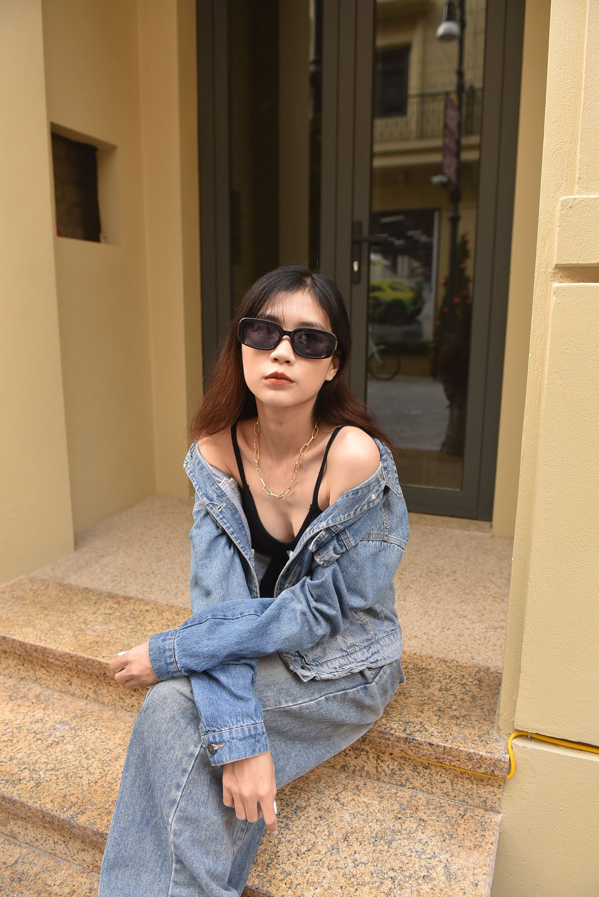 Woman Wearing Black and Pink Diesel Sports Bra With Black Jacket and ...