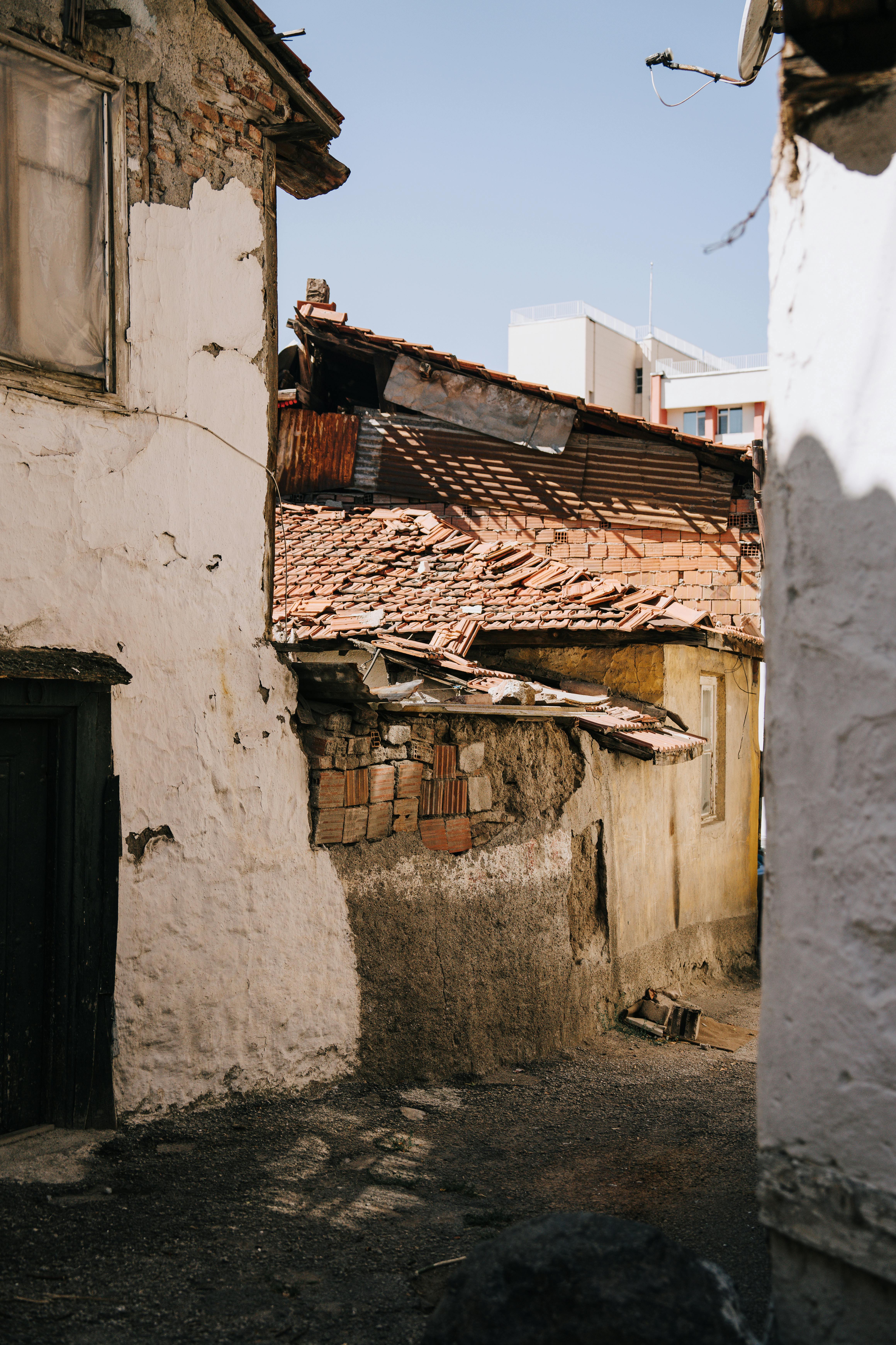 Alley with Damaged Buildings in Town · Free Stock Photo