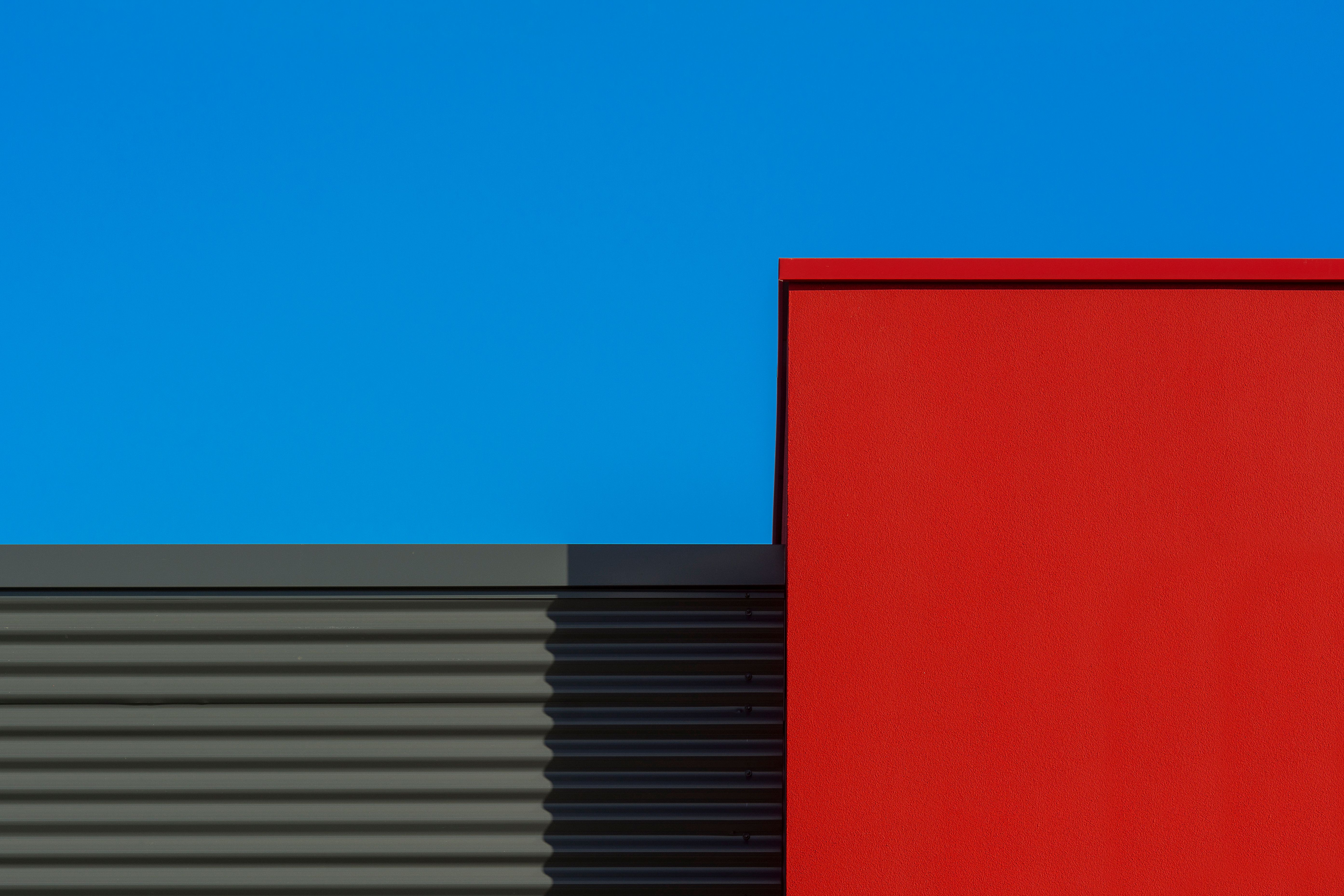 Red and Black Buildings in Sunlight · Free Stock Photo