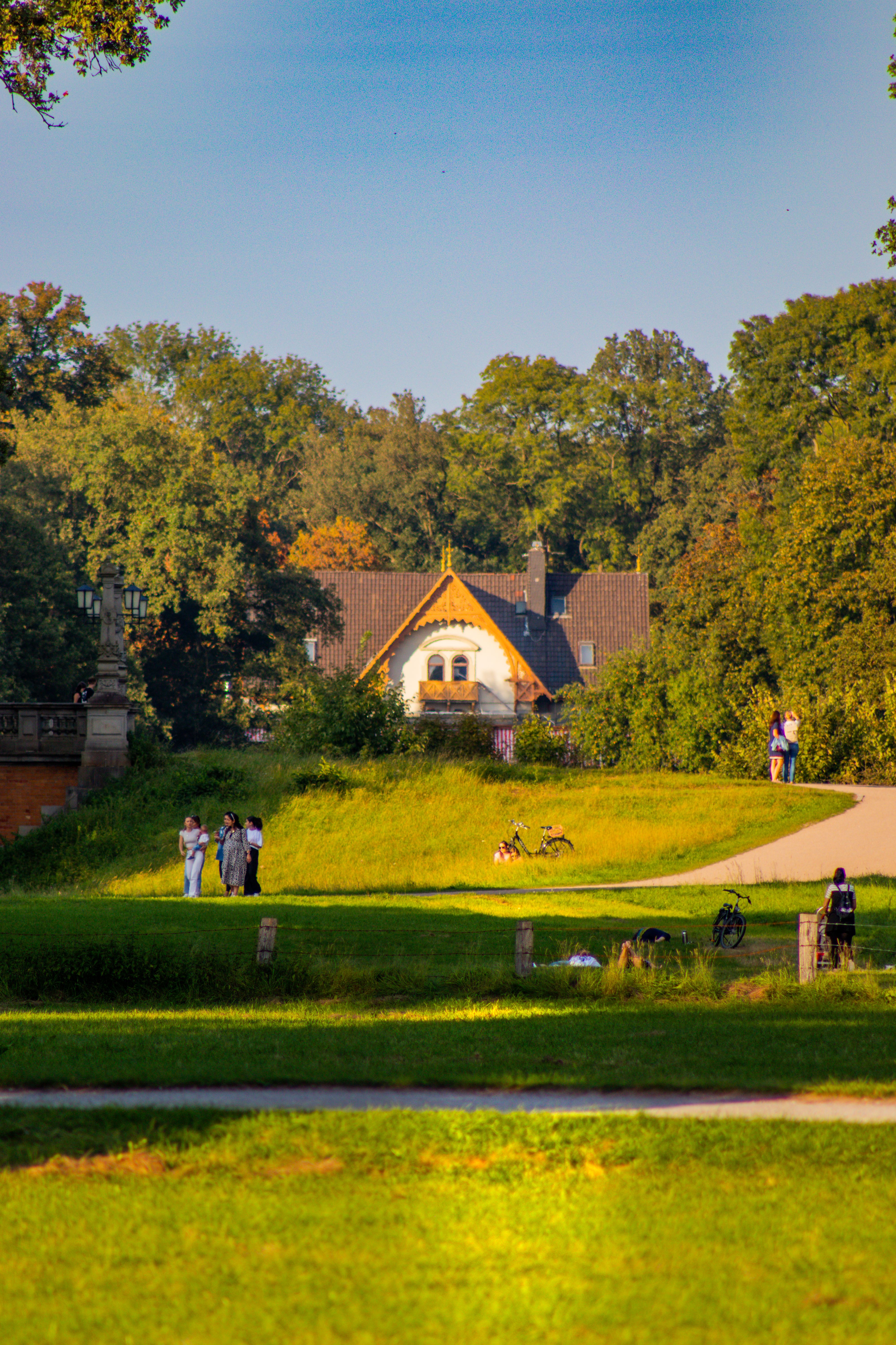 People on Grassland by Pond in Countryside · Free Stock Photo