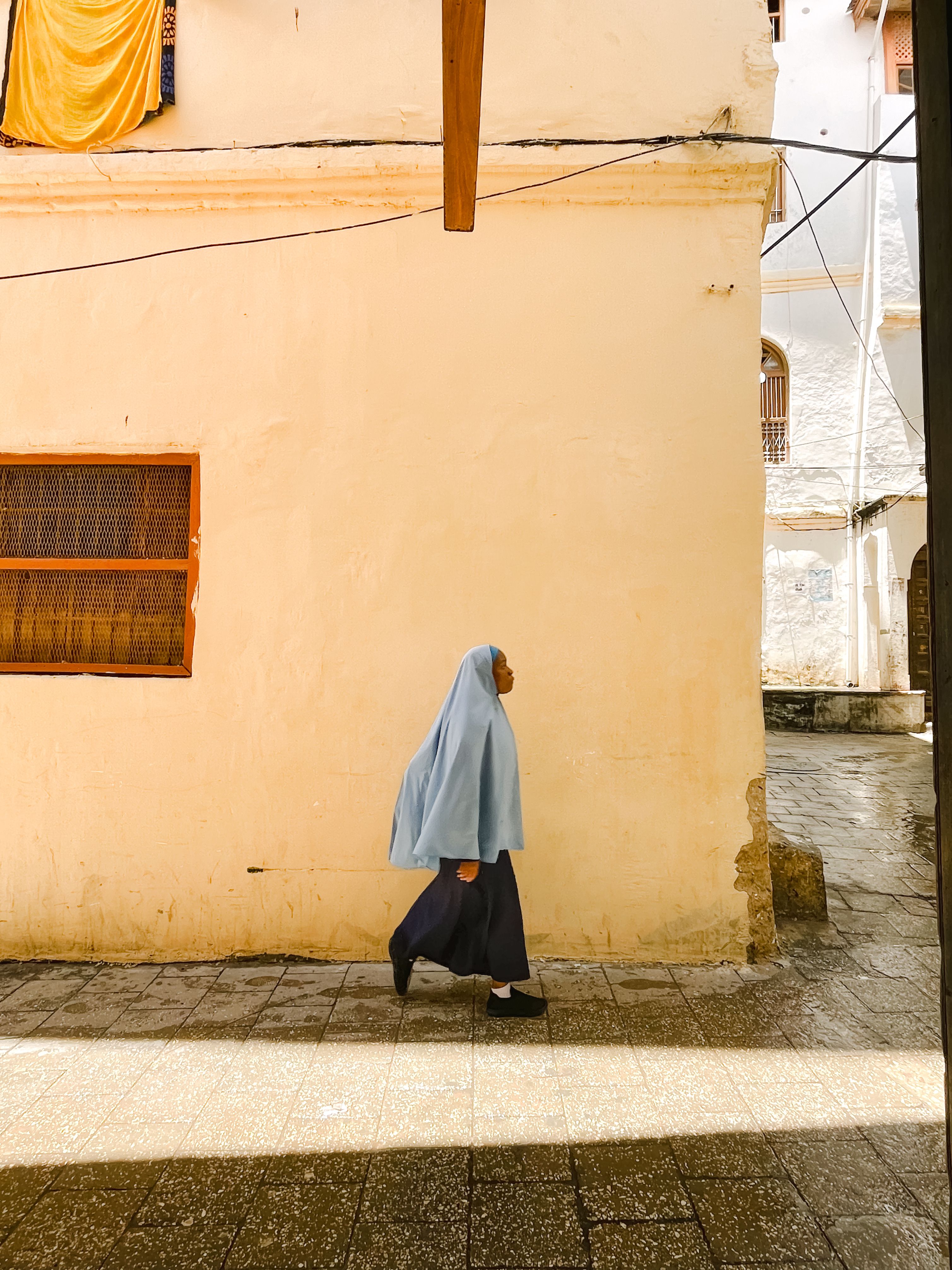 Woman in Traditional Clothes Walking on the Street · Free Stock Photo