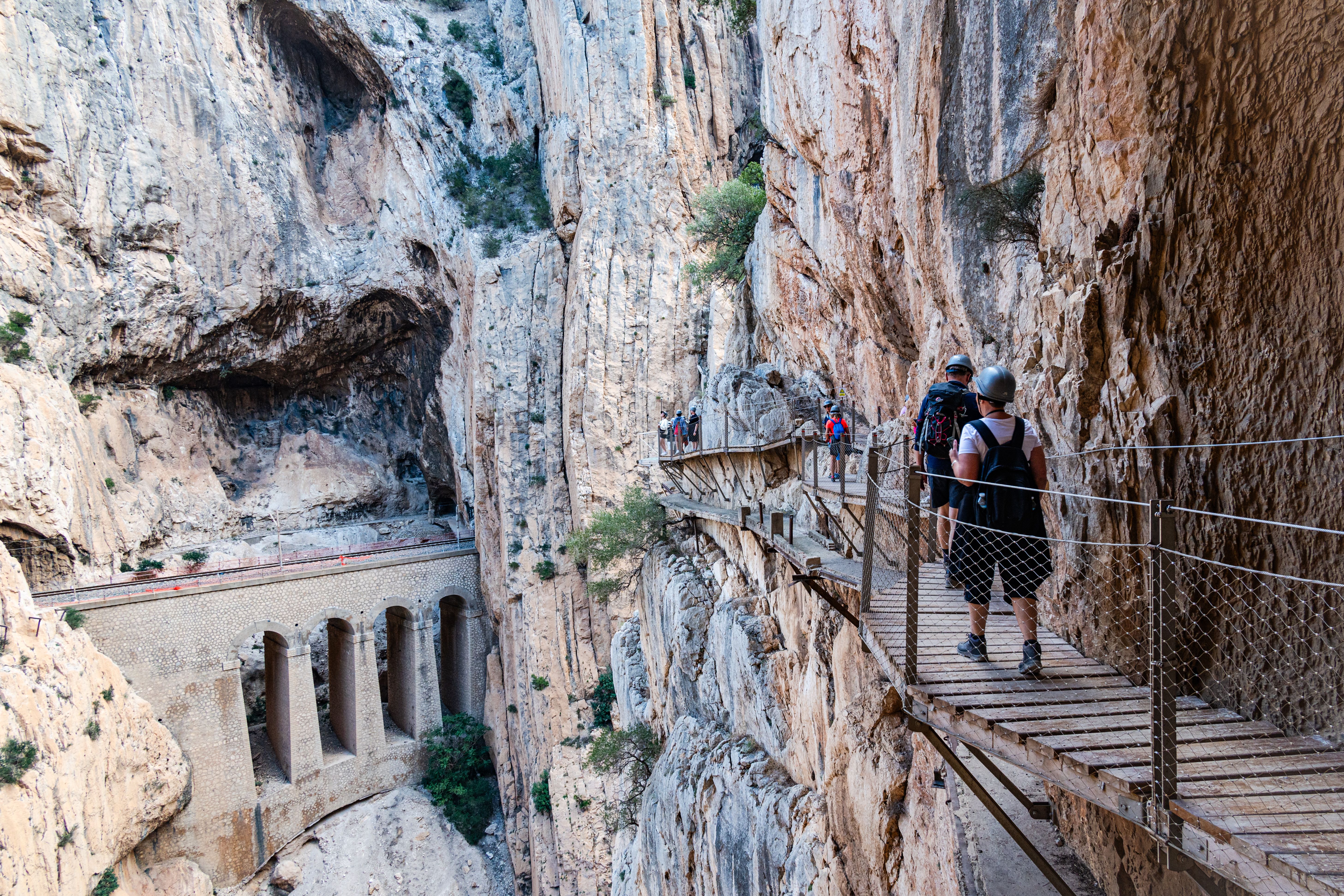 People on a Walkway along a Steep Wall of a Gorge in El Chorro, near ...