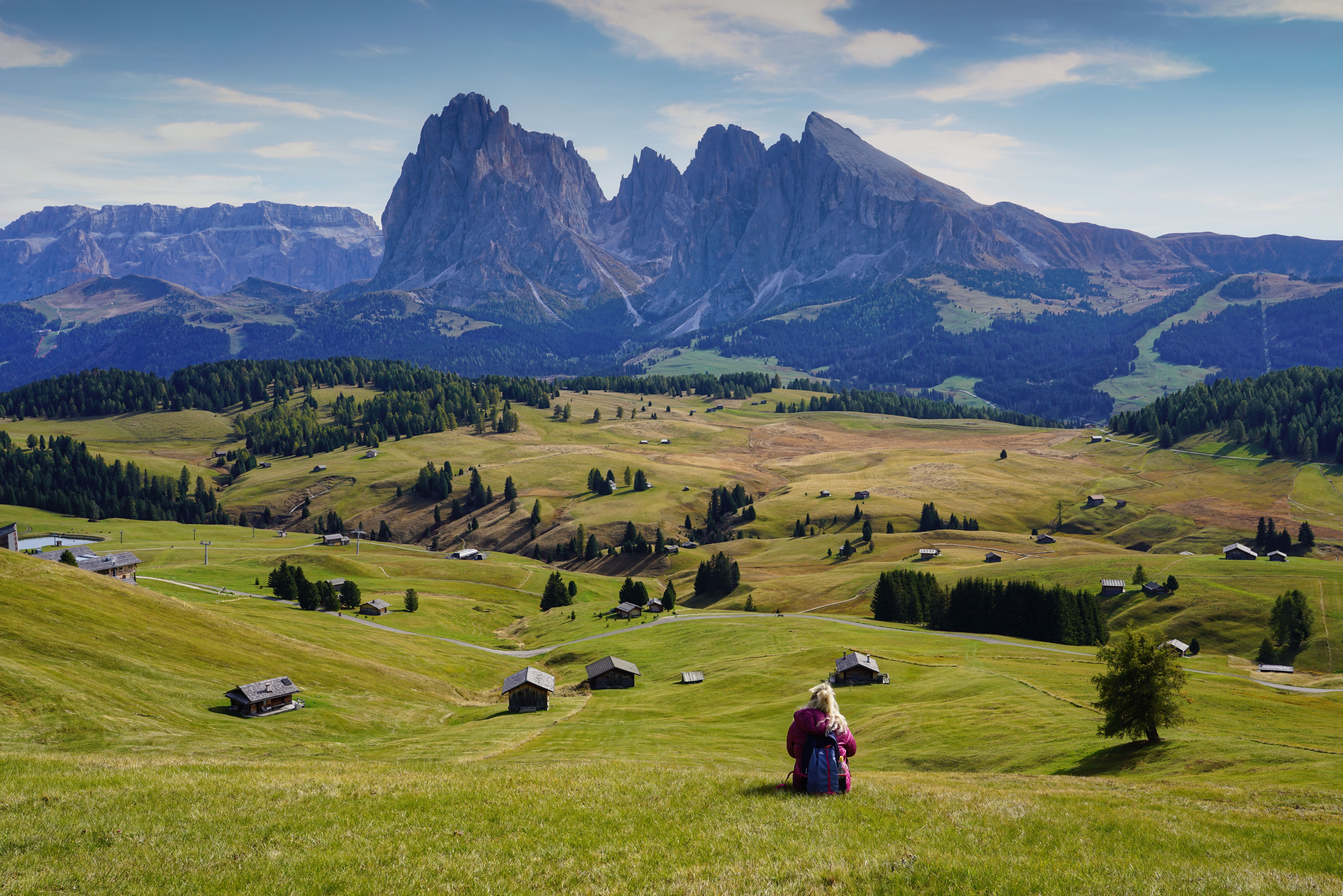 Hiker on Hill Looking at Rural Landscape · Free Stock Photo