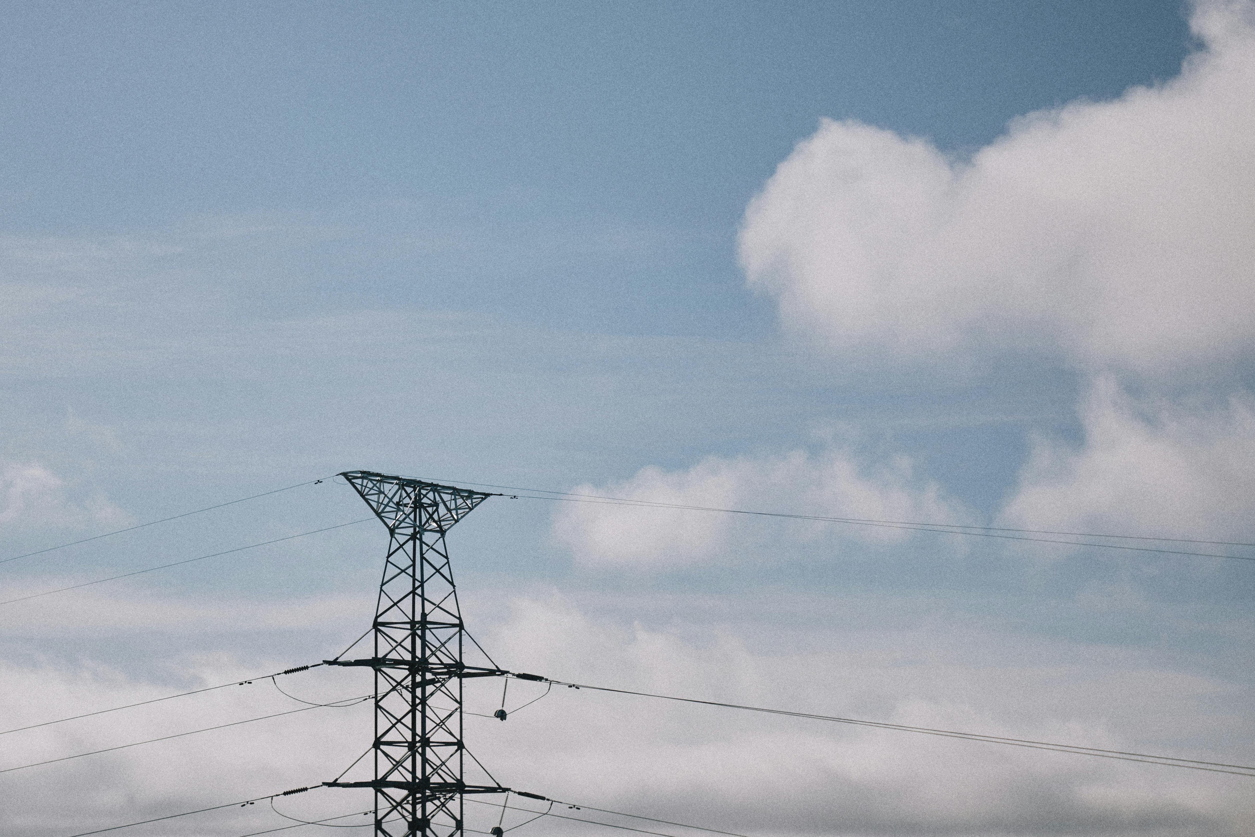 View of an Electricity Pole and Lines against Blue Sky with White ...