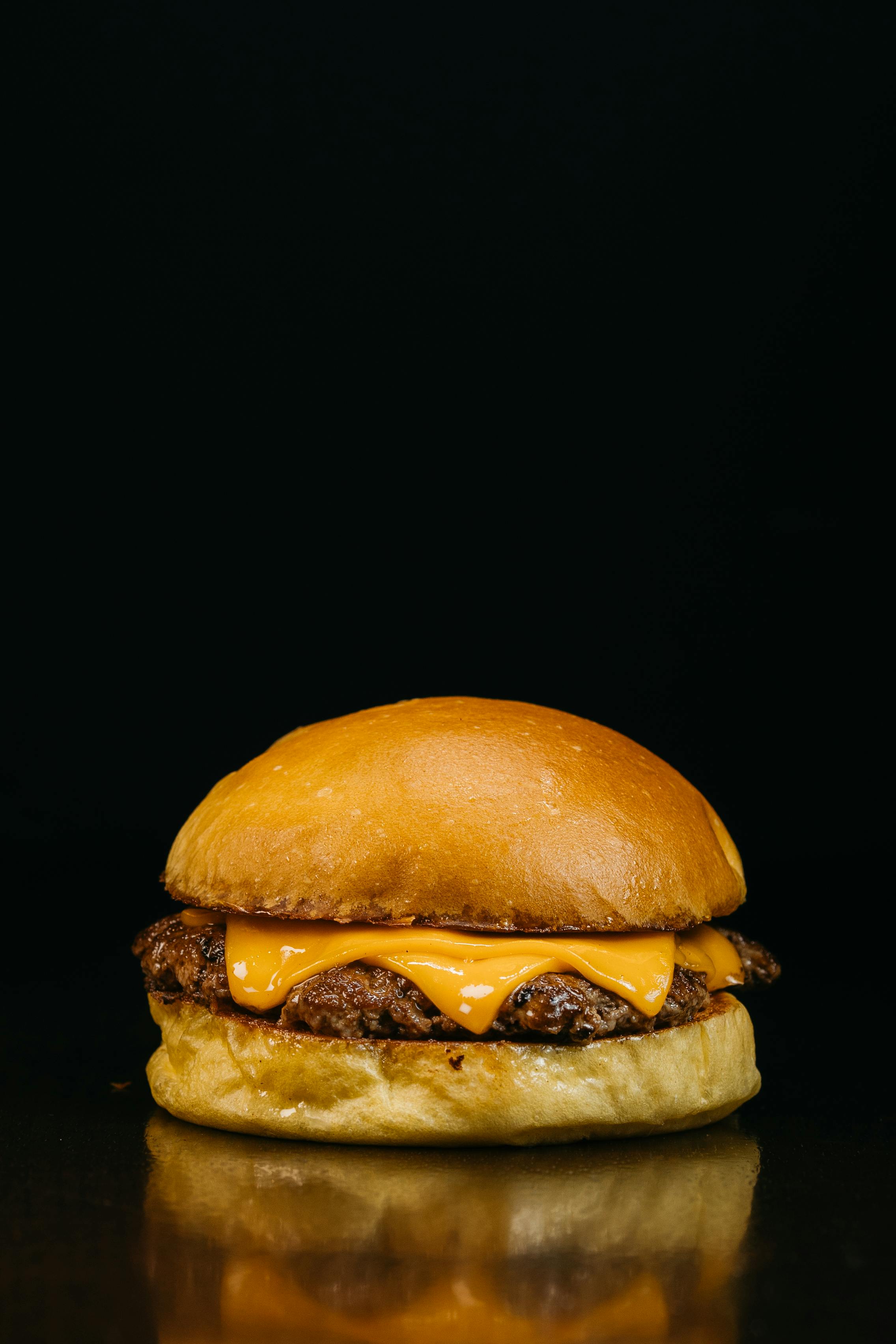 Close-up of a Cheeseburger · Free Stock Photo
