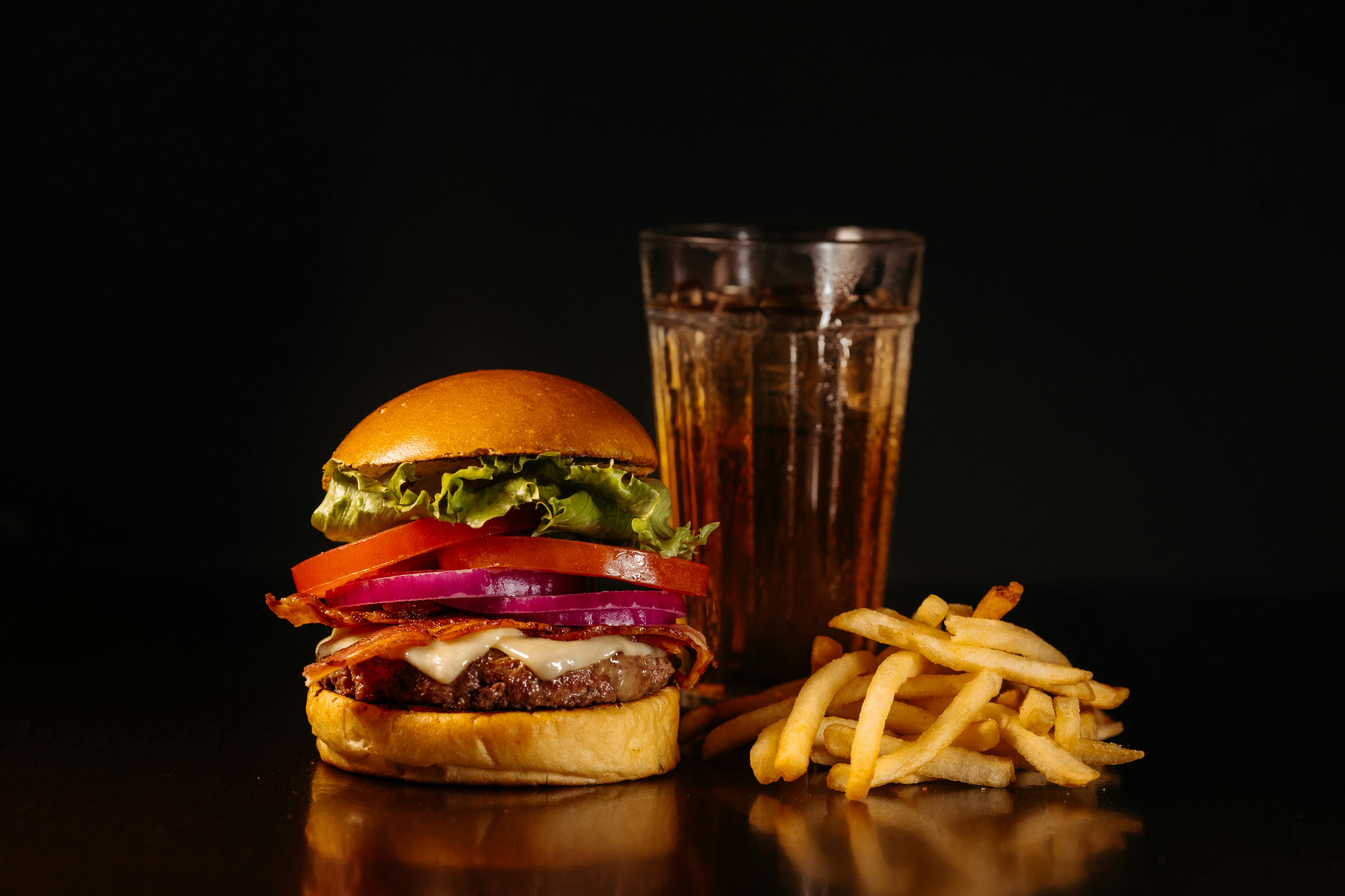 Burger and French Fries Served in a Restaurant · Free Stock Photo