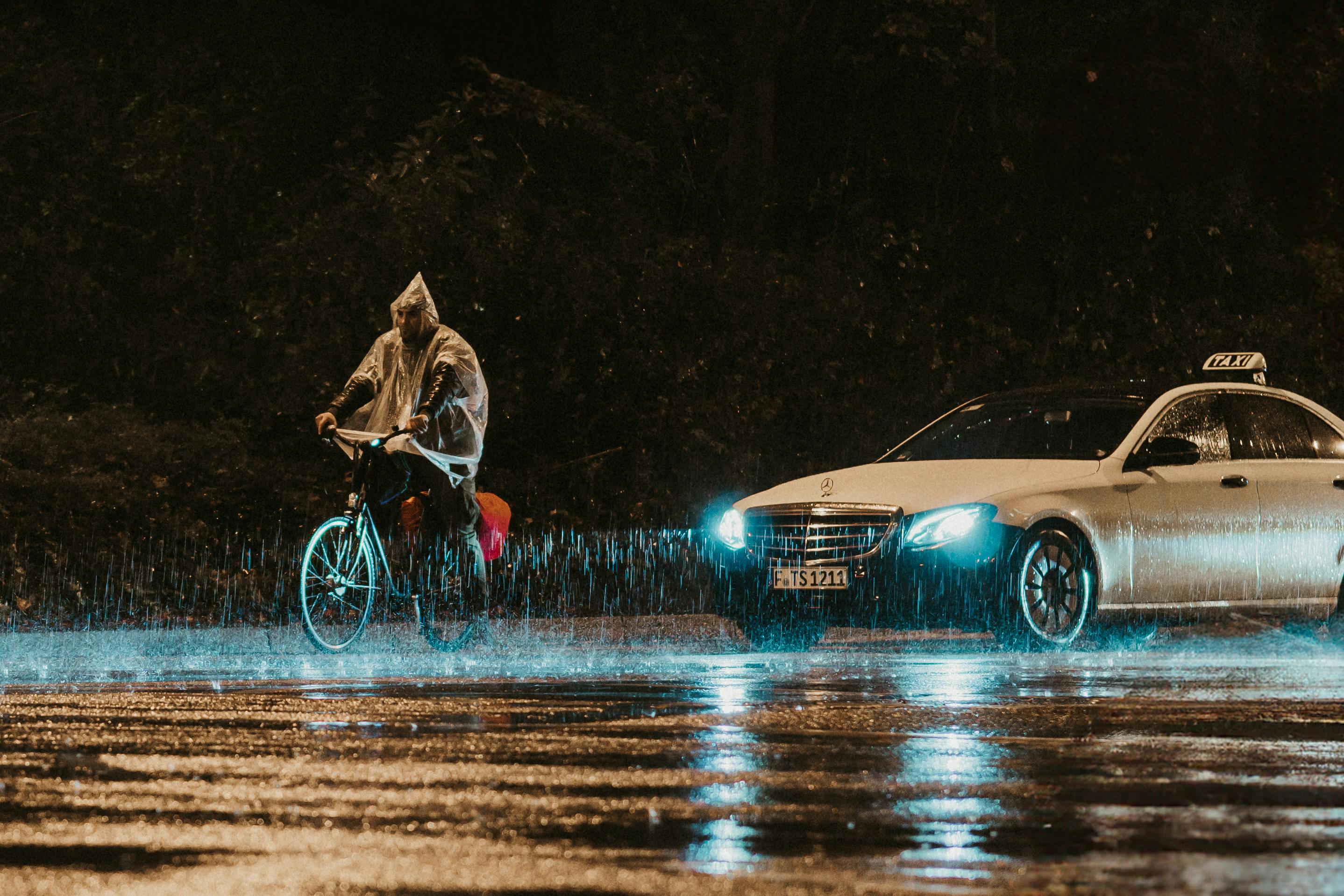 Person Riding a Bicycle during Rainy Day · Free Stock Photo