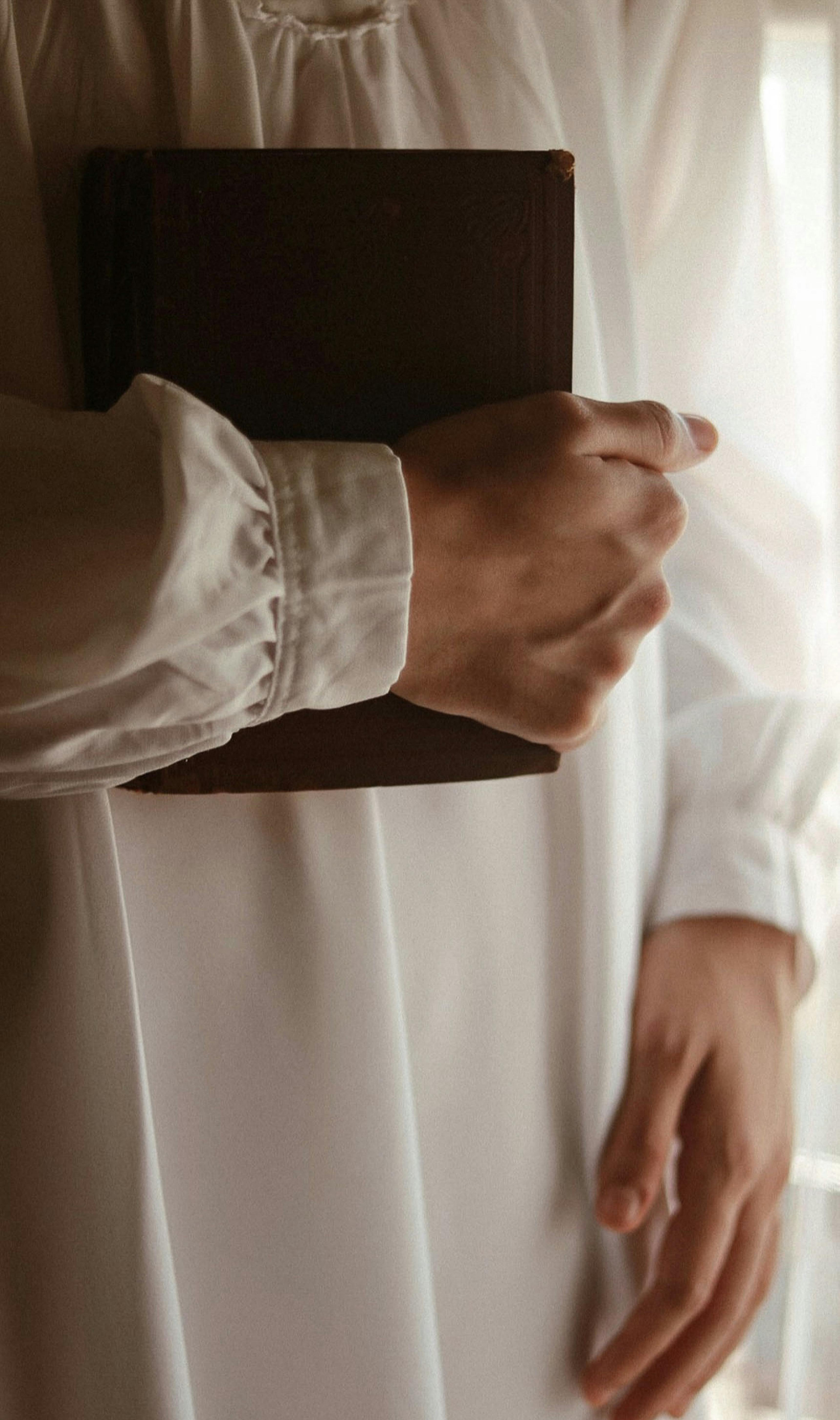Close up of Woman in White Dress Holding Book · Free Stock Photo