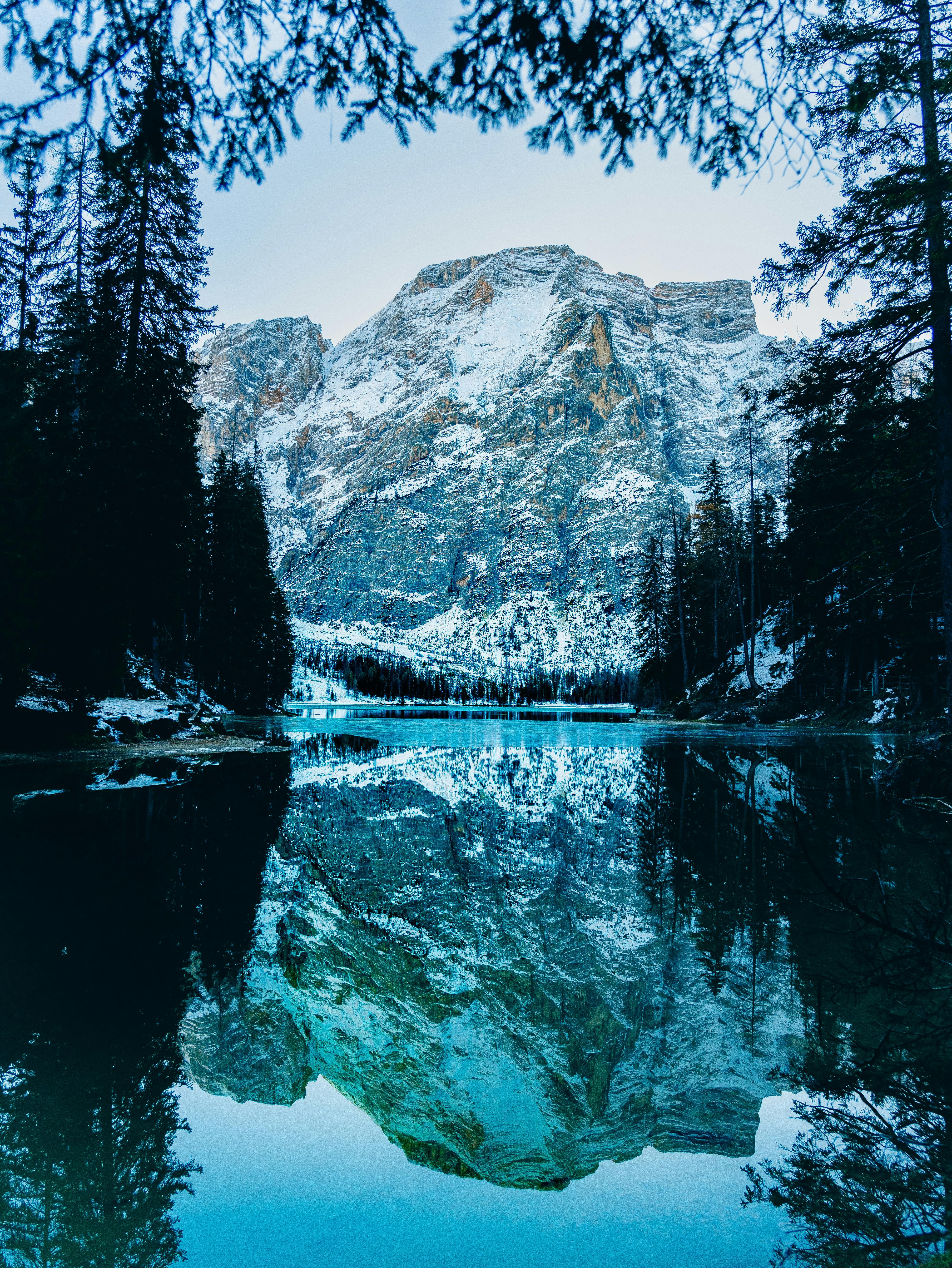Mountain in Snow Reflecting in Lake · Free Stock Photo