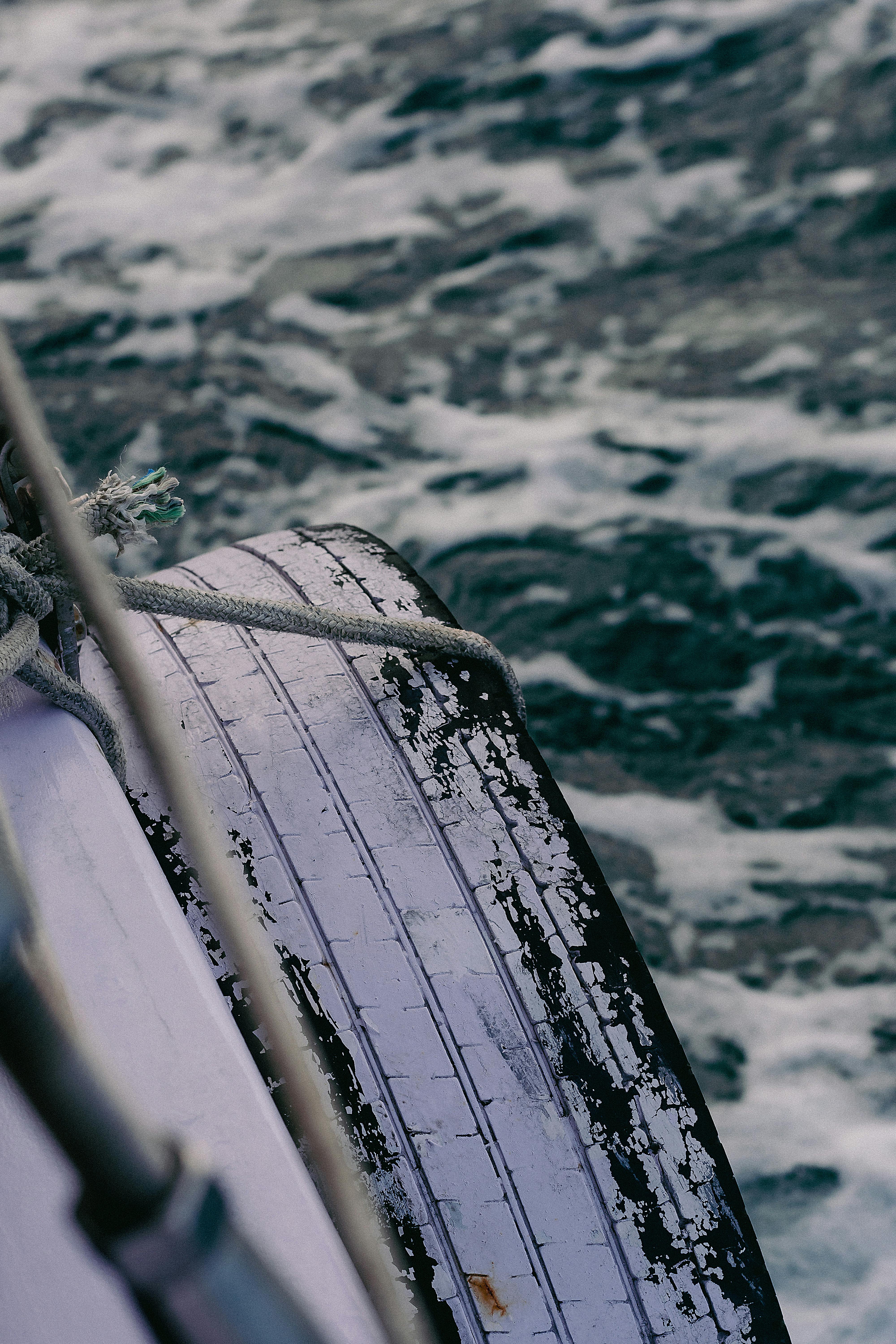 A Safety Tire on a Boat on a Sea · Free Stock Photo