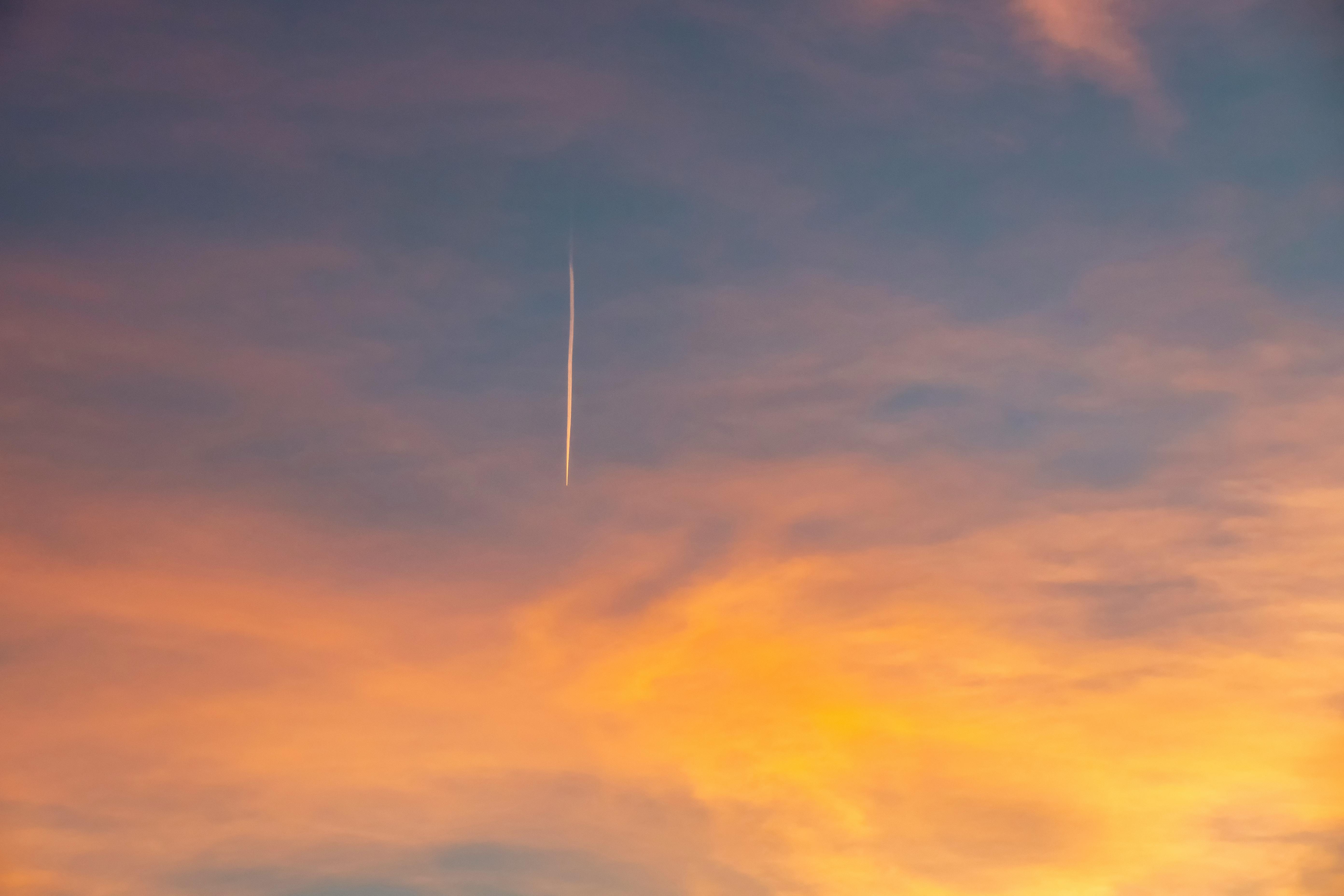 Yellow Cloudscape with a Vertical Contrail · Free Stock Photo