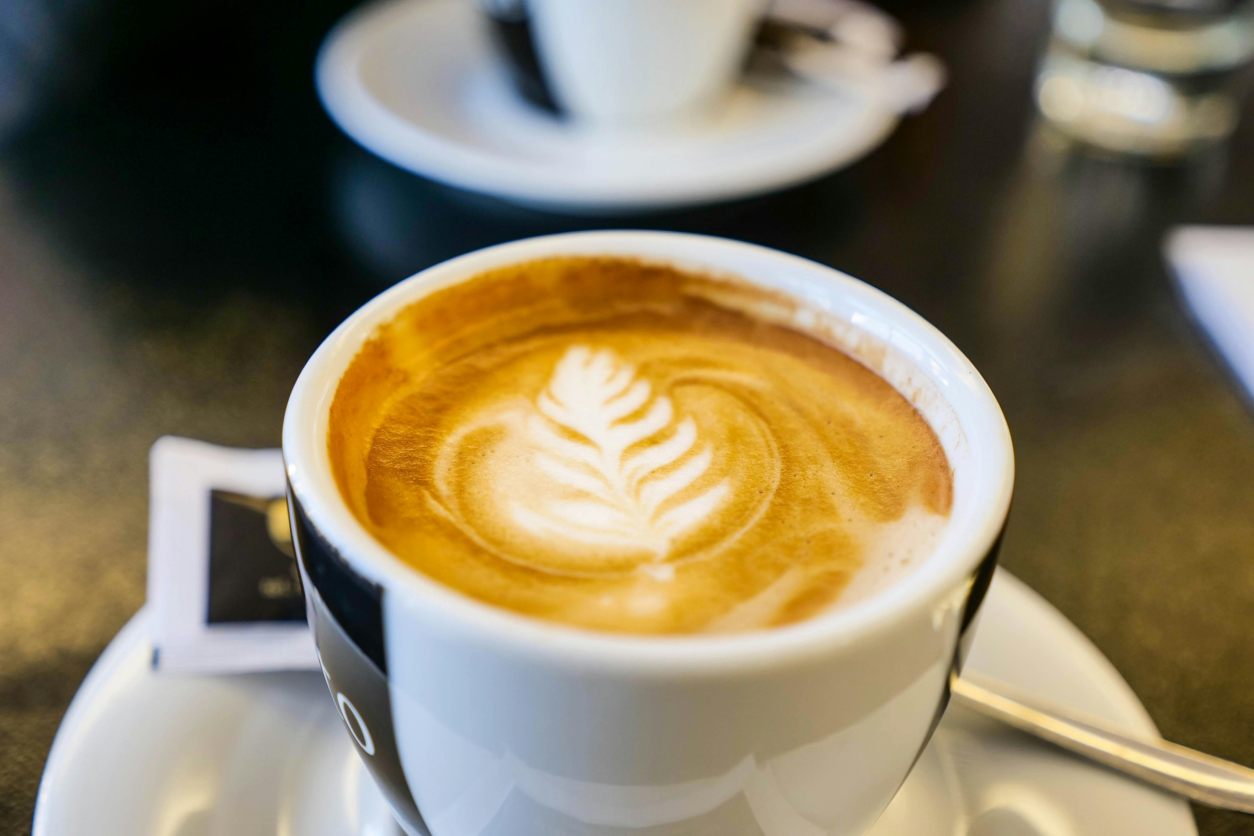 Cup of delicious coffee with froth on breakfast in cafeteria · Free ...