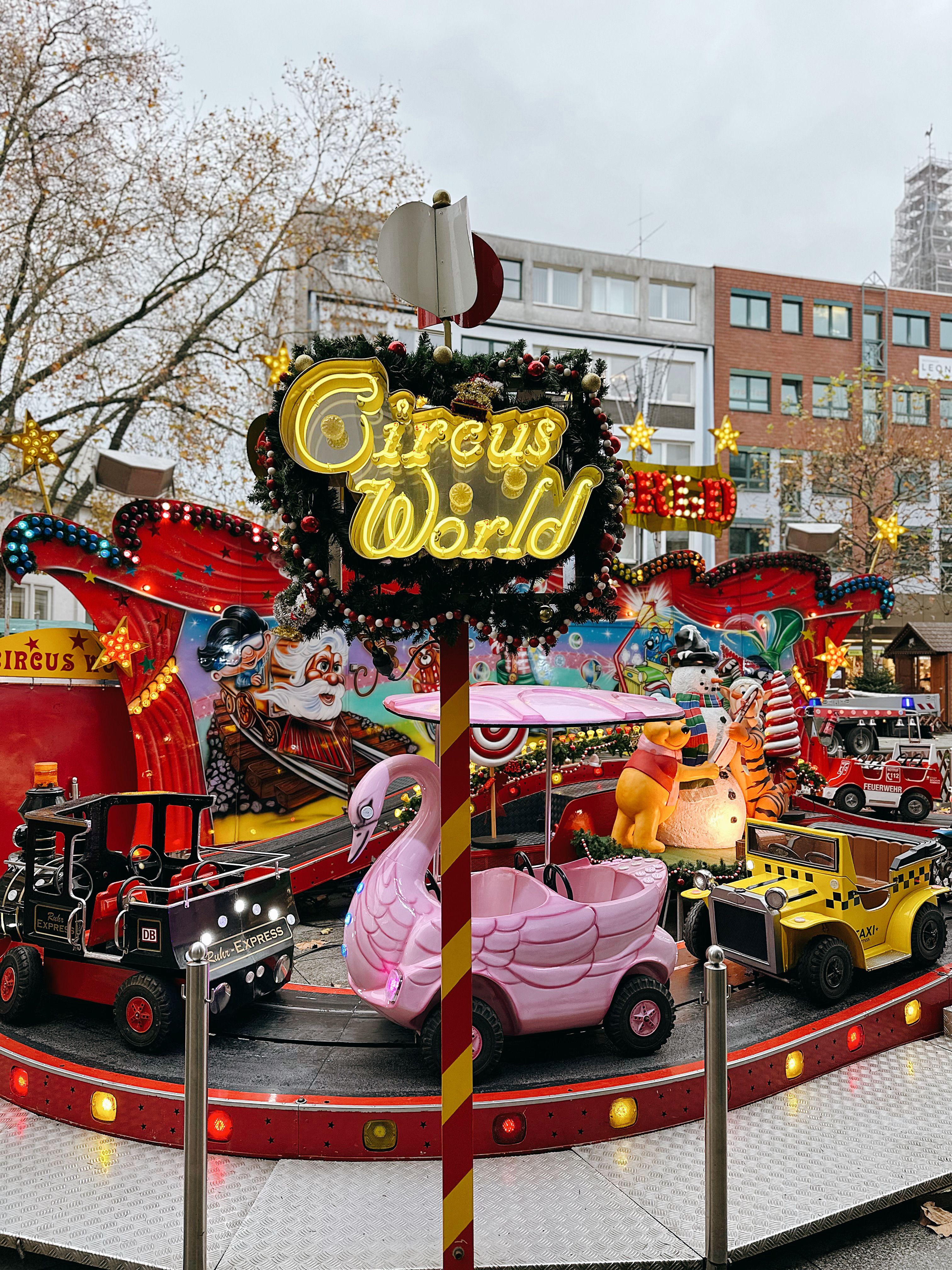 Colorful Cars on Carousel in Amusement Park · Free Stock Photo