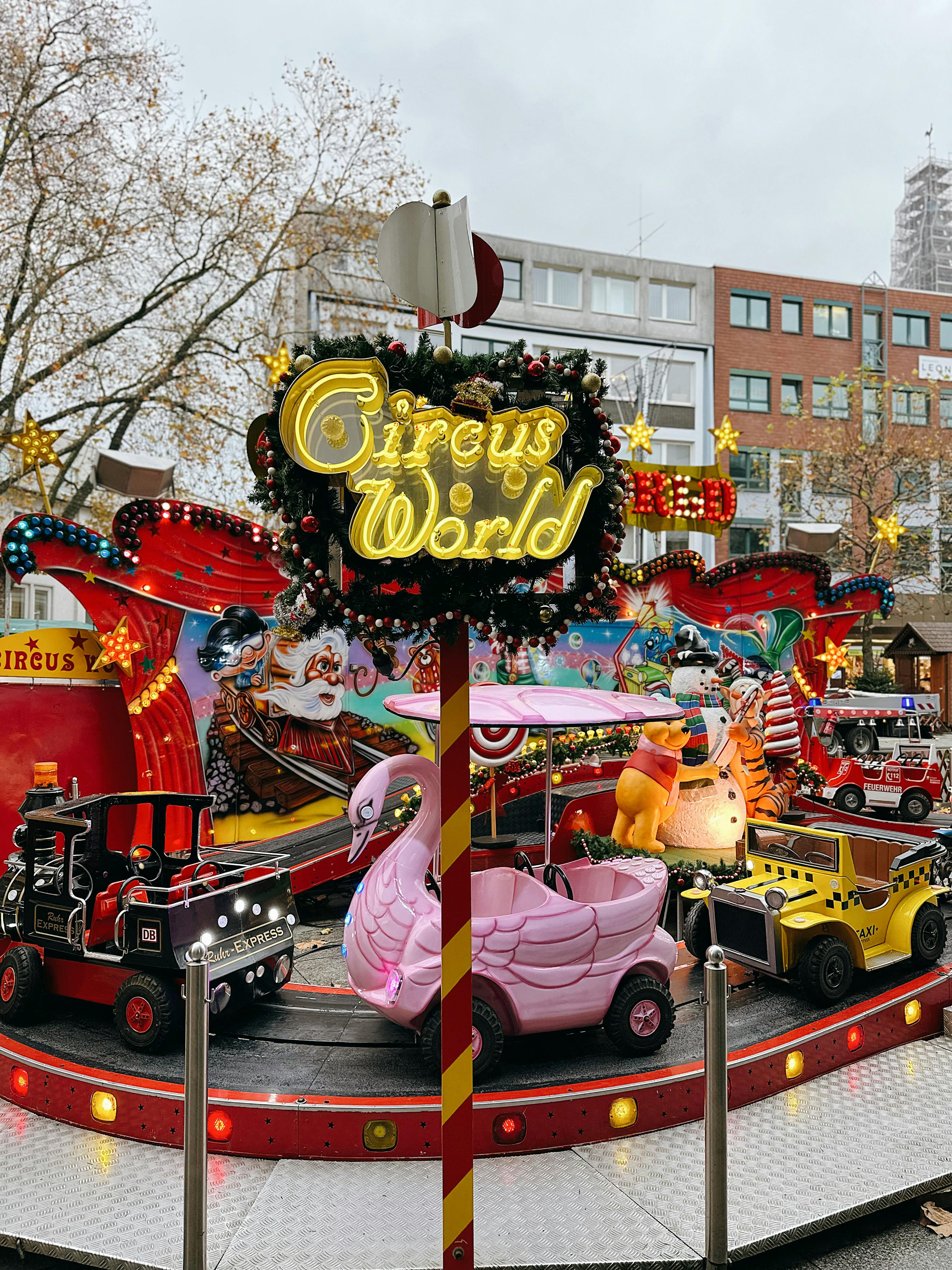 Colorful Cars on Carousel in Amusement Park · Free Stock Photo