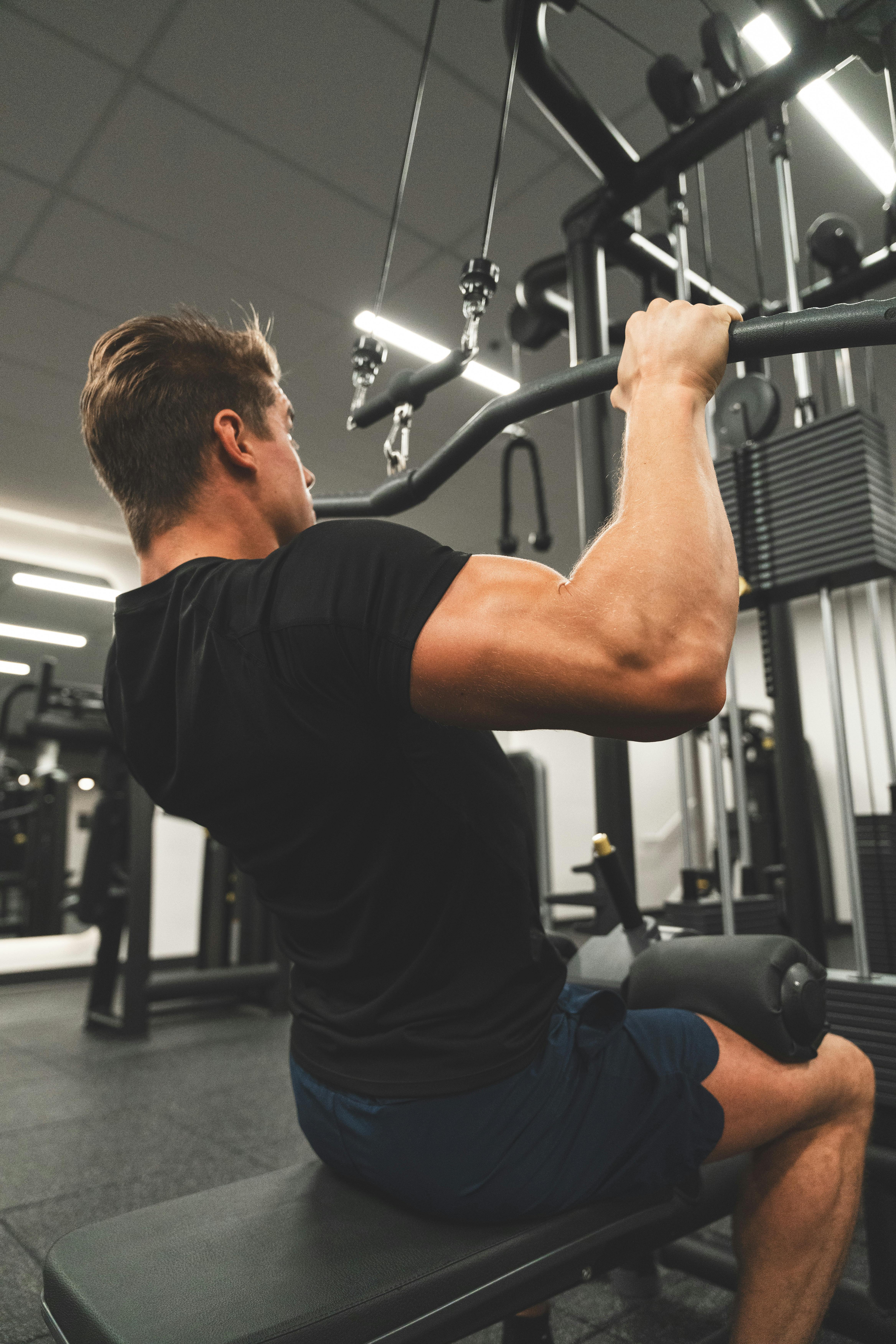 Back View of Man Exercising at Gym · Free Stock Photo