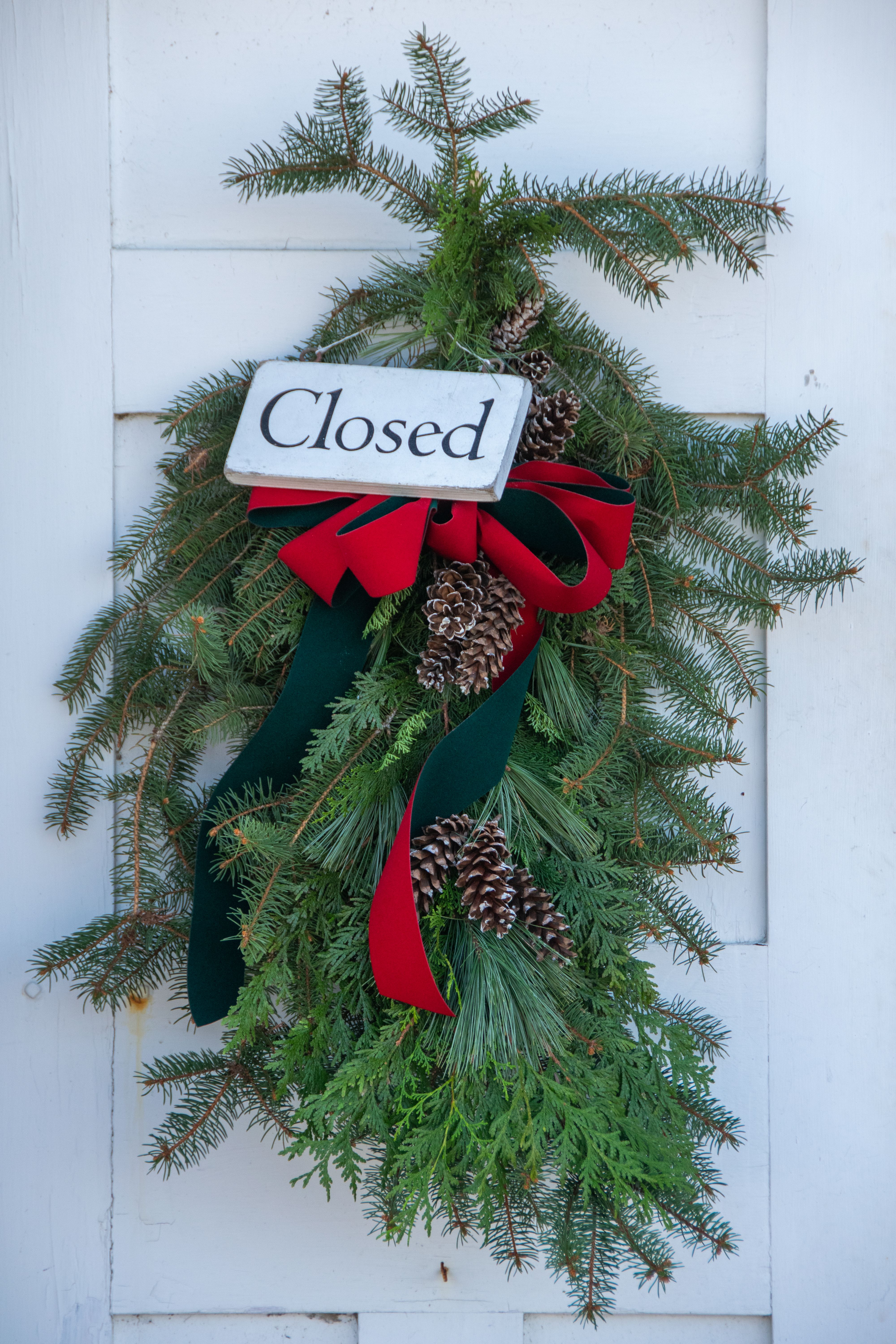 Christmas Decoration Made of Pine Branches Hanging on the Door with a ...