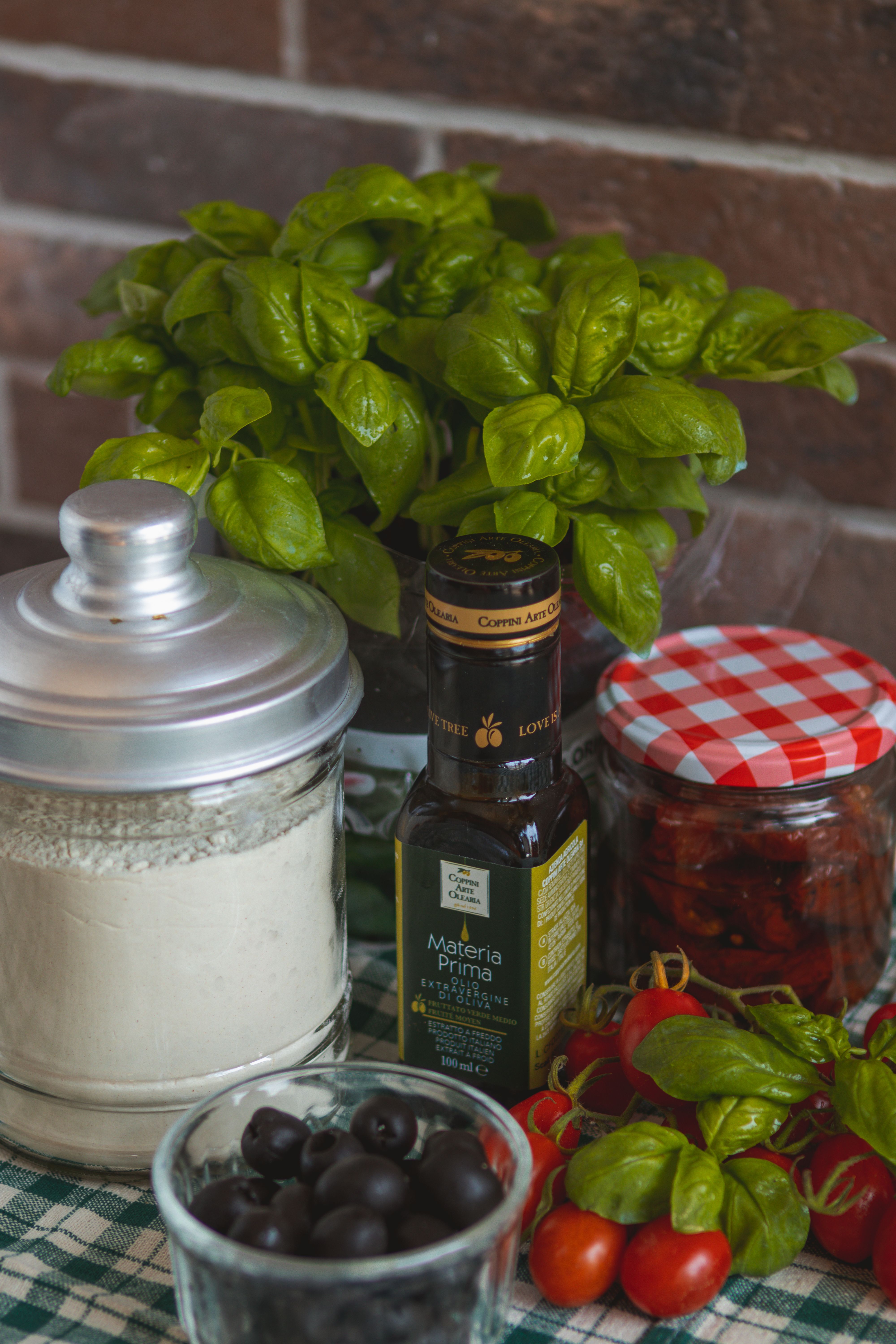 Rustic Olive Oil Stand with Fresh Herbs · Free Stock Photo