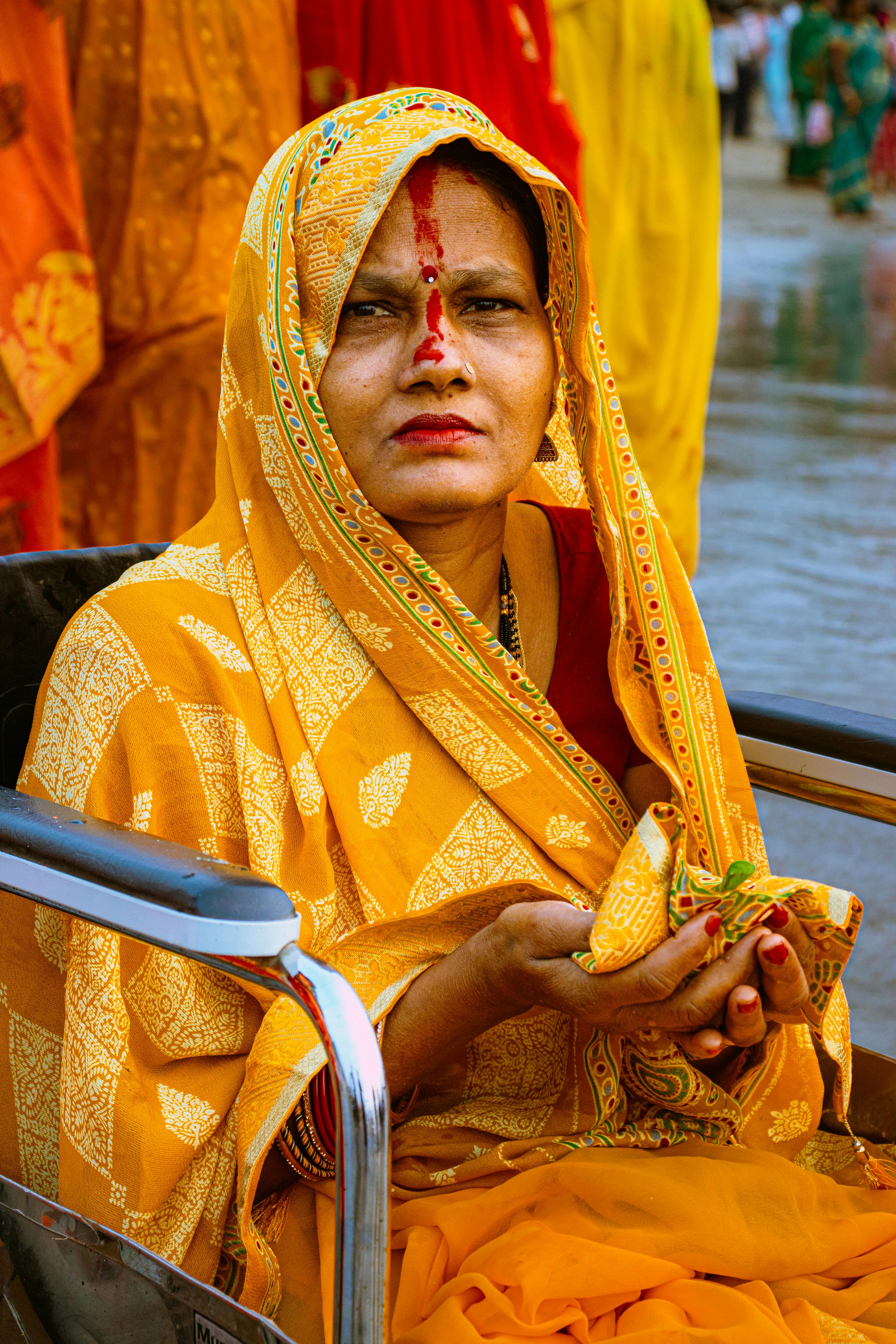 Woman Sitting in Yellow, Traditional Clothing · Free Stock Photo