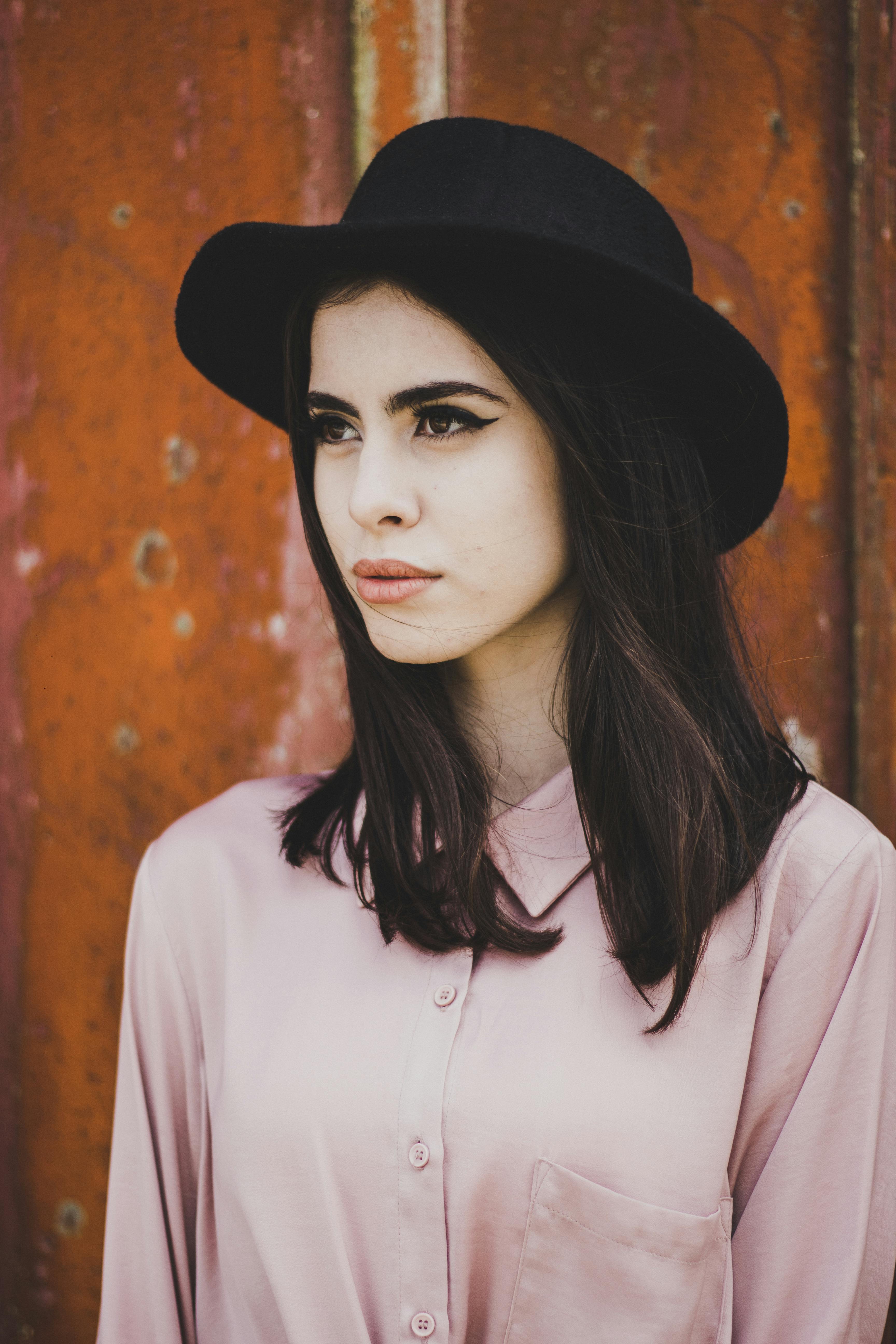 Woman Holding Her Chin Looking Up · Free Stock Photo