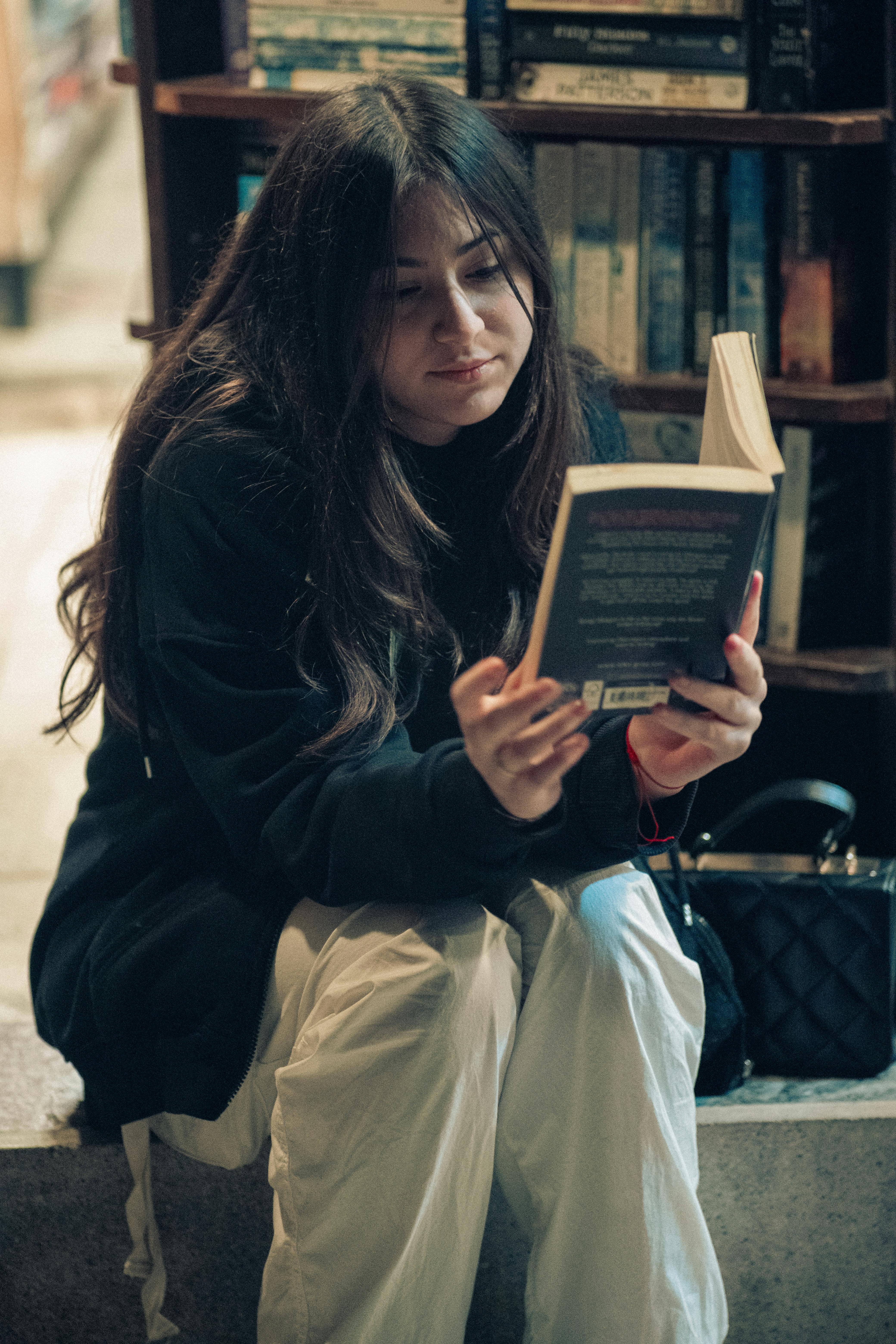 Selective Focus Photo of Woman Reading Book · Free Stock Photo