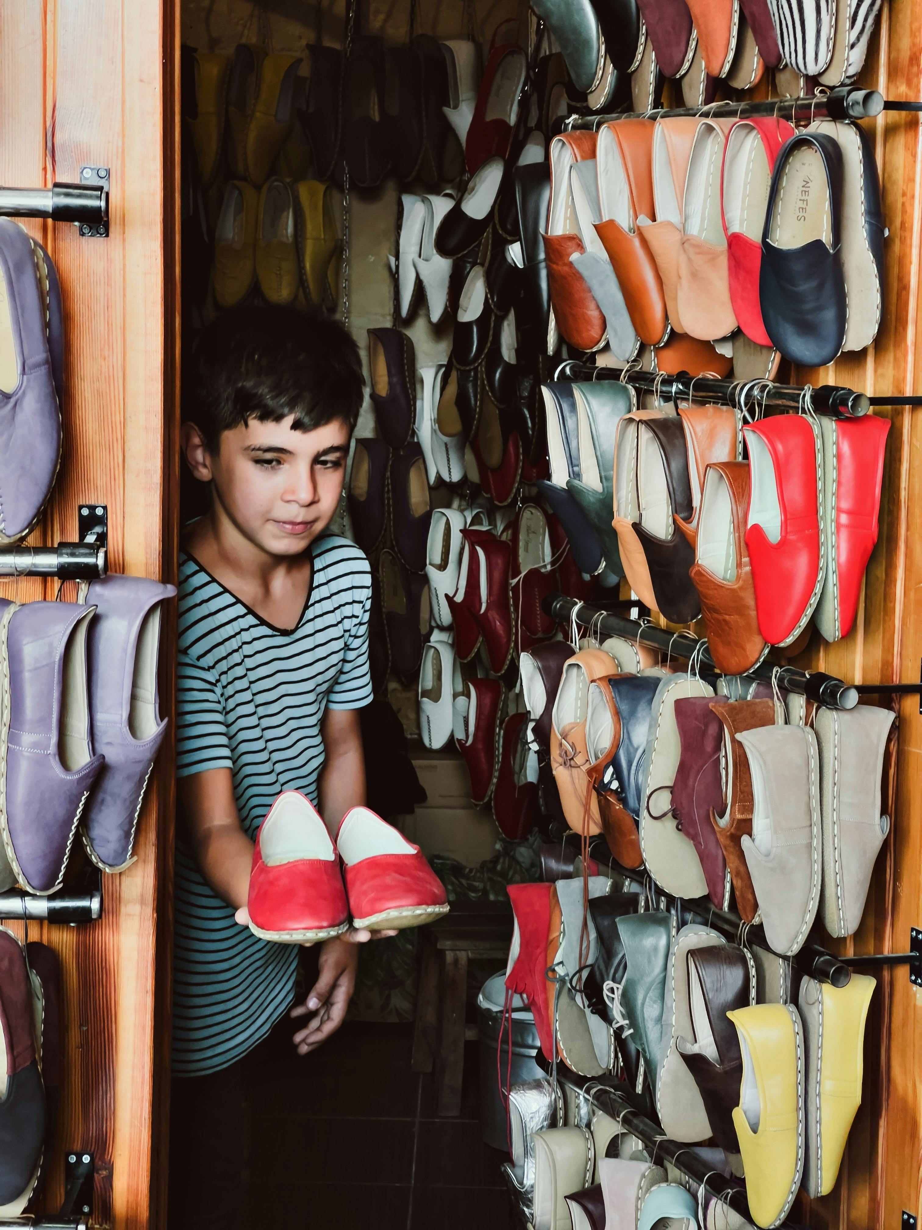 Boy with Shoes at Shoemaker · Free Stock Photo