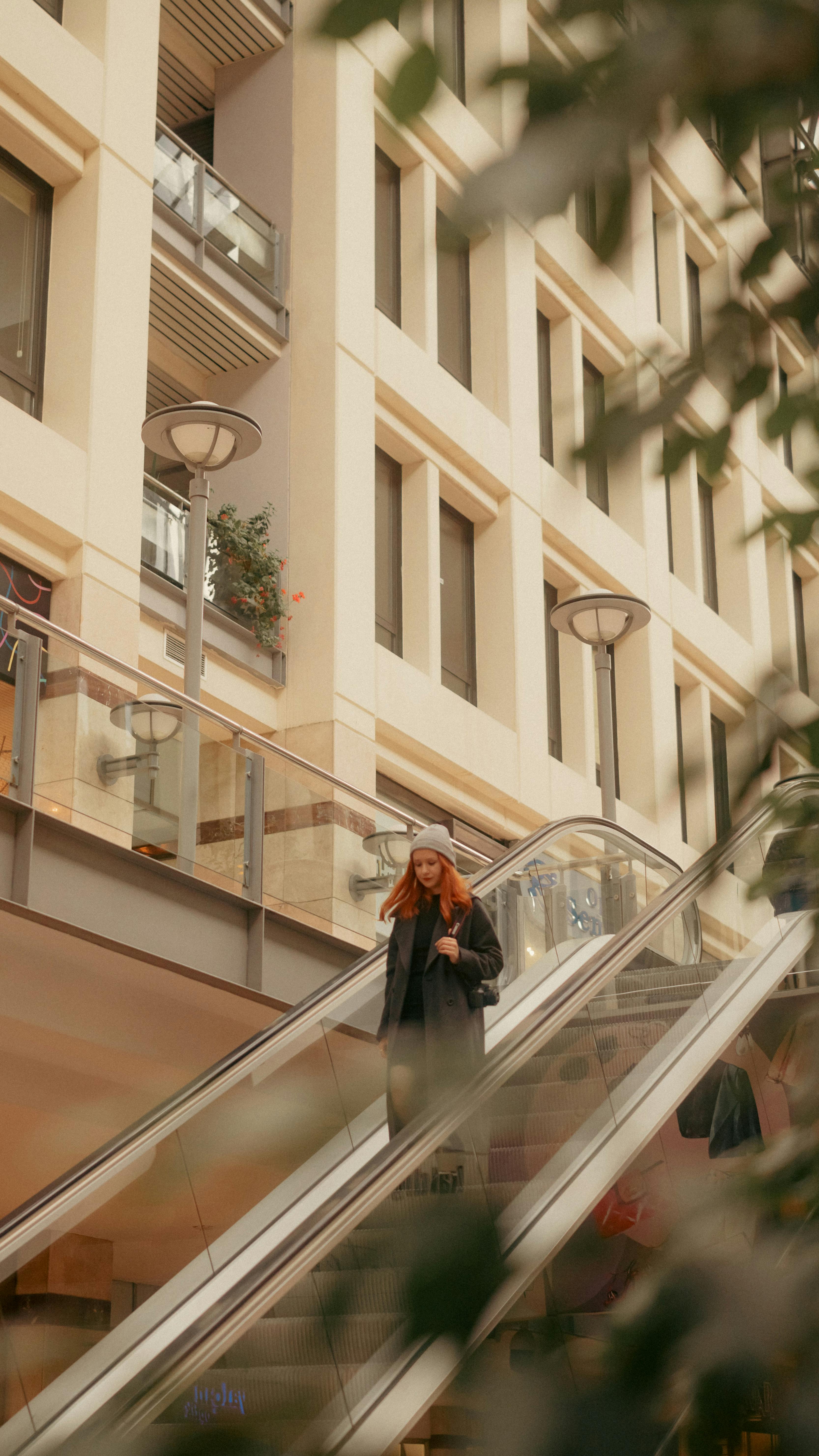 Woman Looking at Modern Office Building · Free Stock Photo