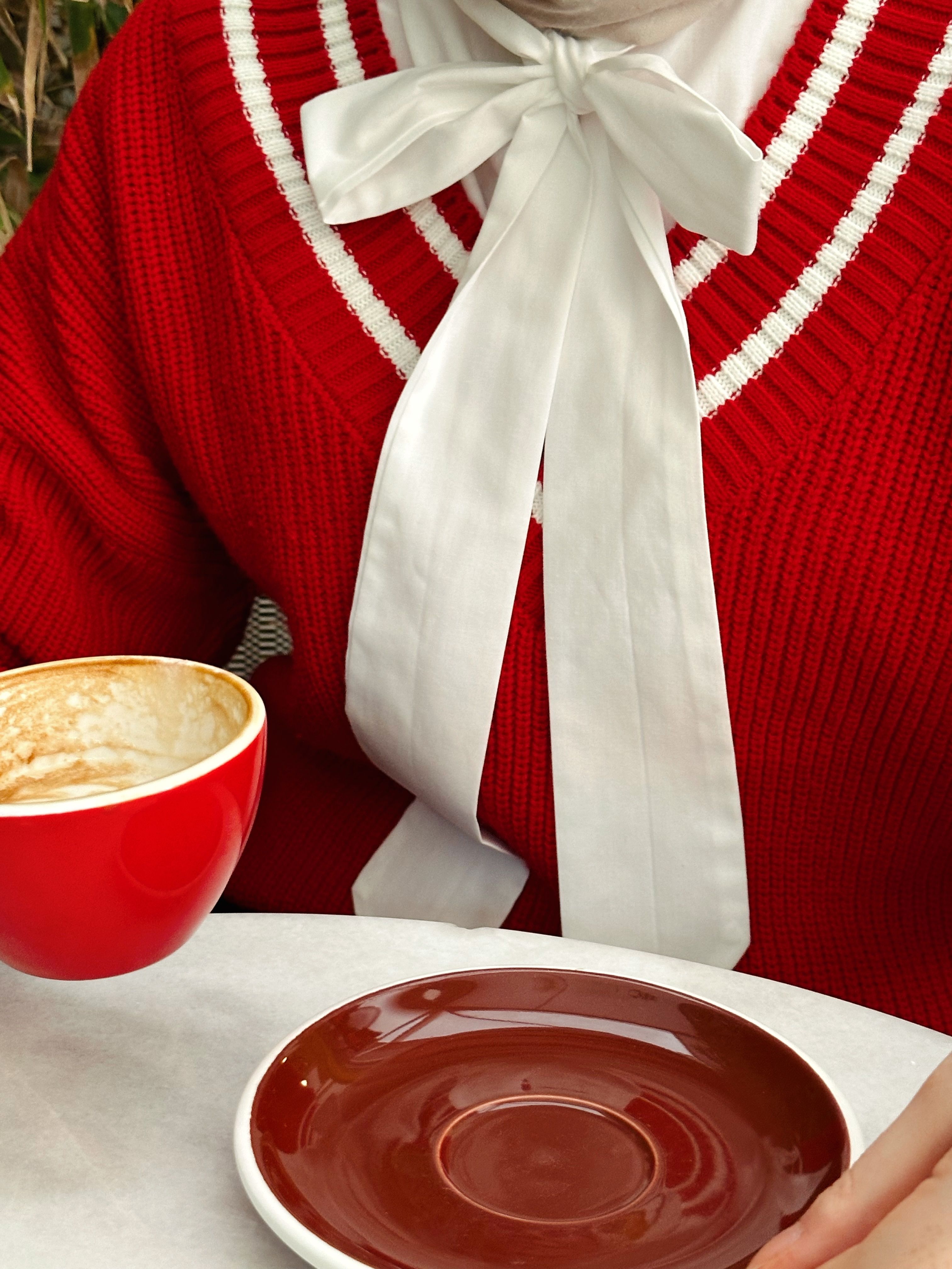 Woman Wearing Sweater and Bow Sitting at Table · Free Stock Photo