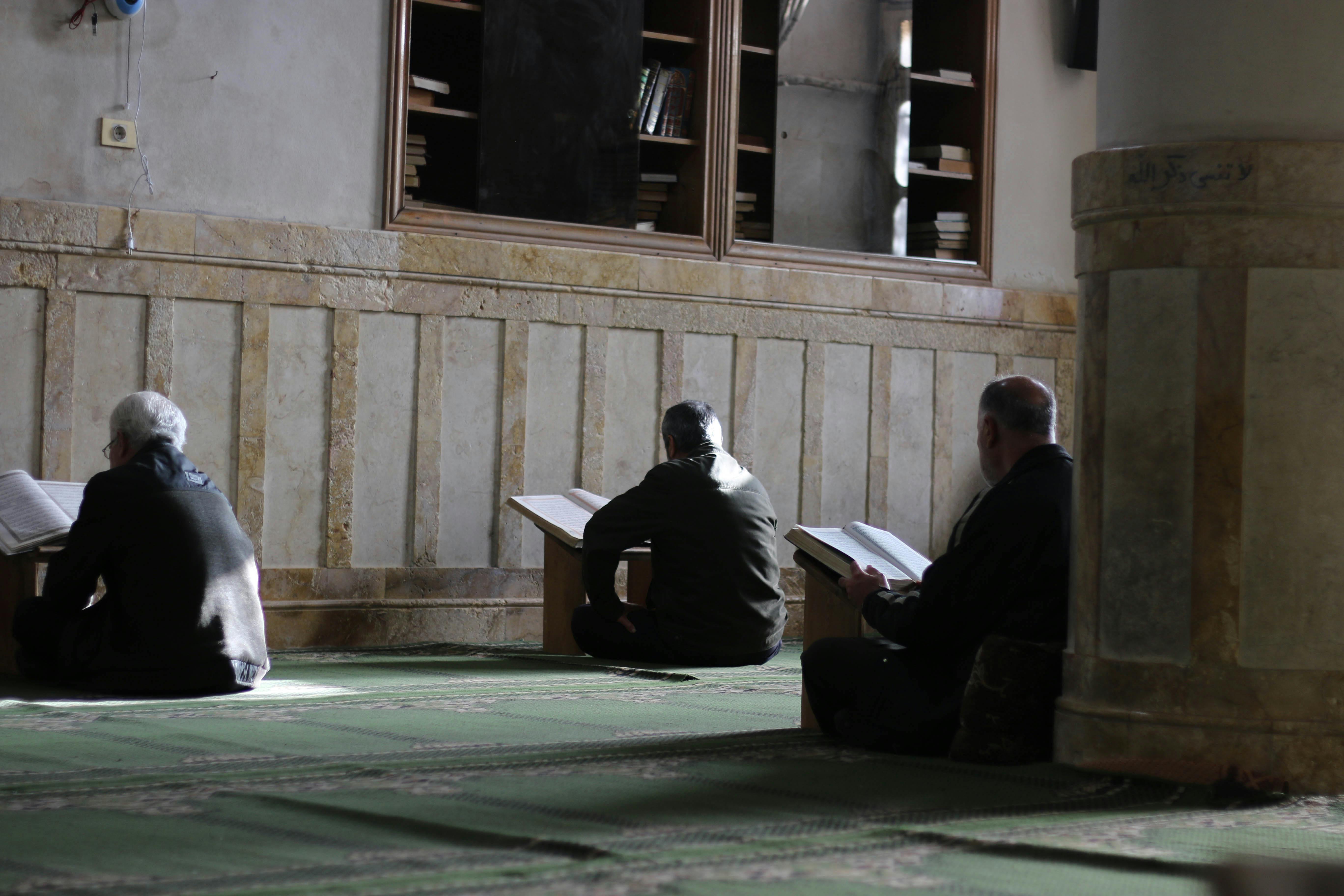 People Sitting with Quran in Mosque · Free Stock Photo