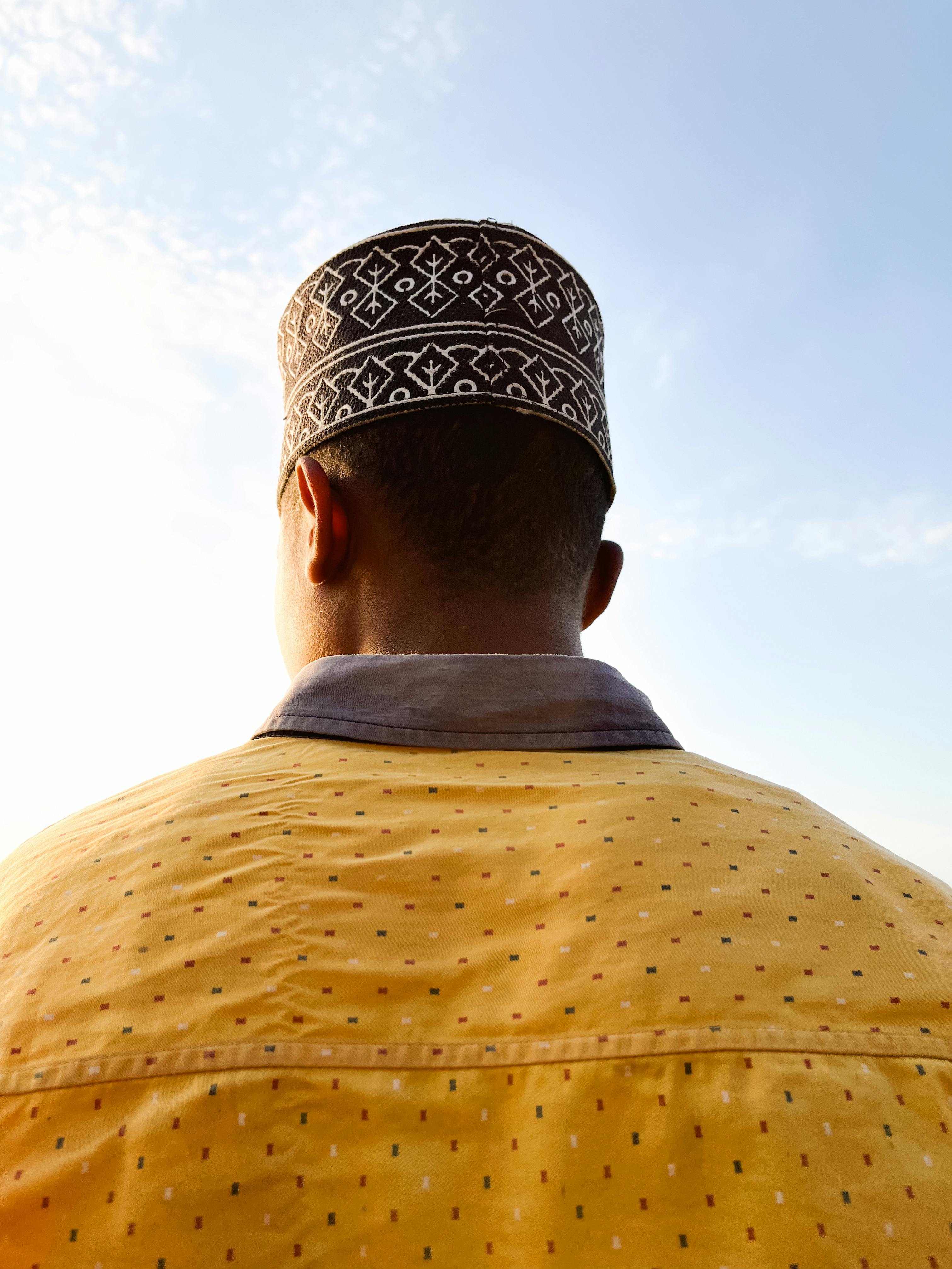 Back View of a Man Wearing Traditional Kufi Cap · Free Stock Photo