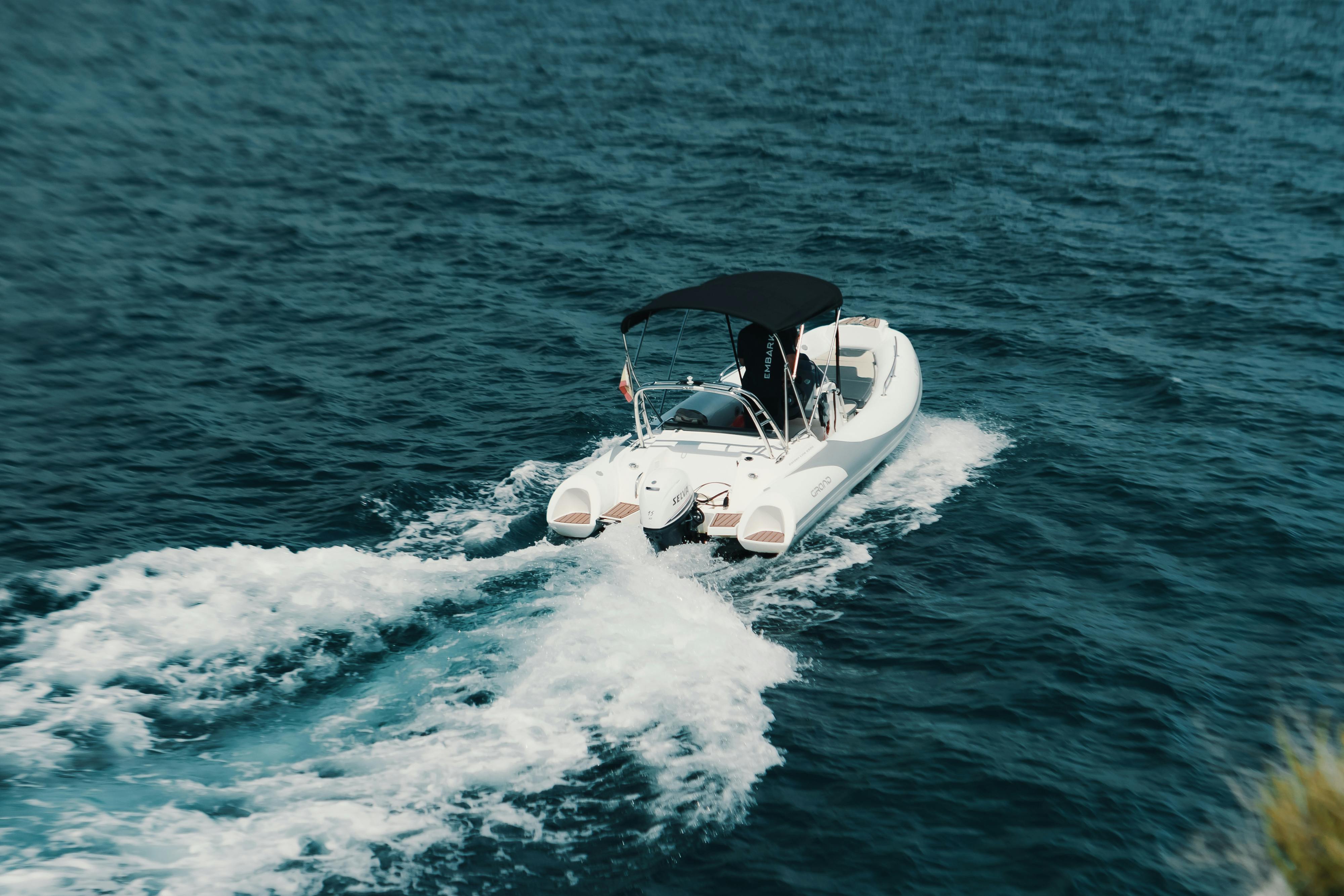 Person on a Motorboat on the Water · Free Stock Photo