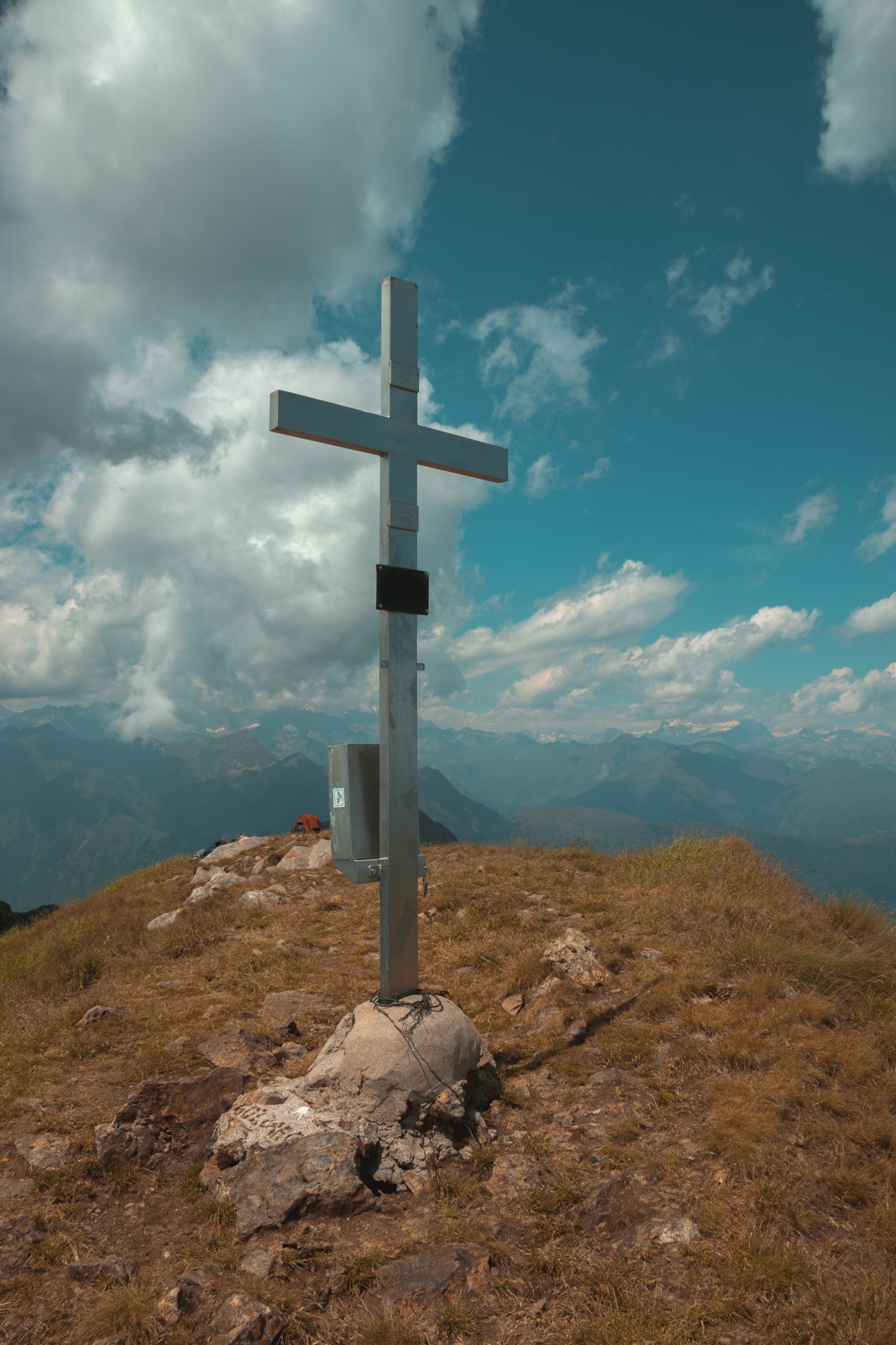 Summit Cross Standing against the Clouds · Free Stock Photo