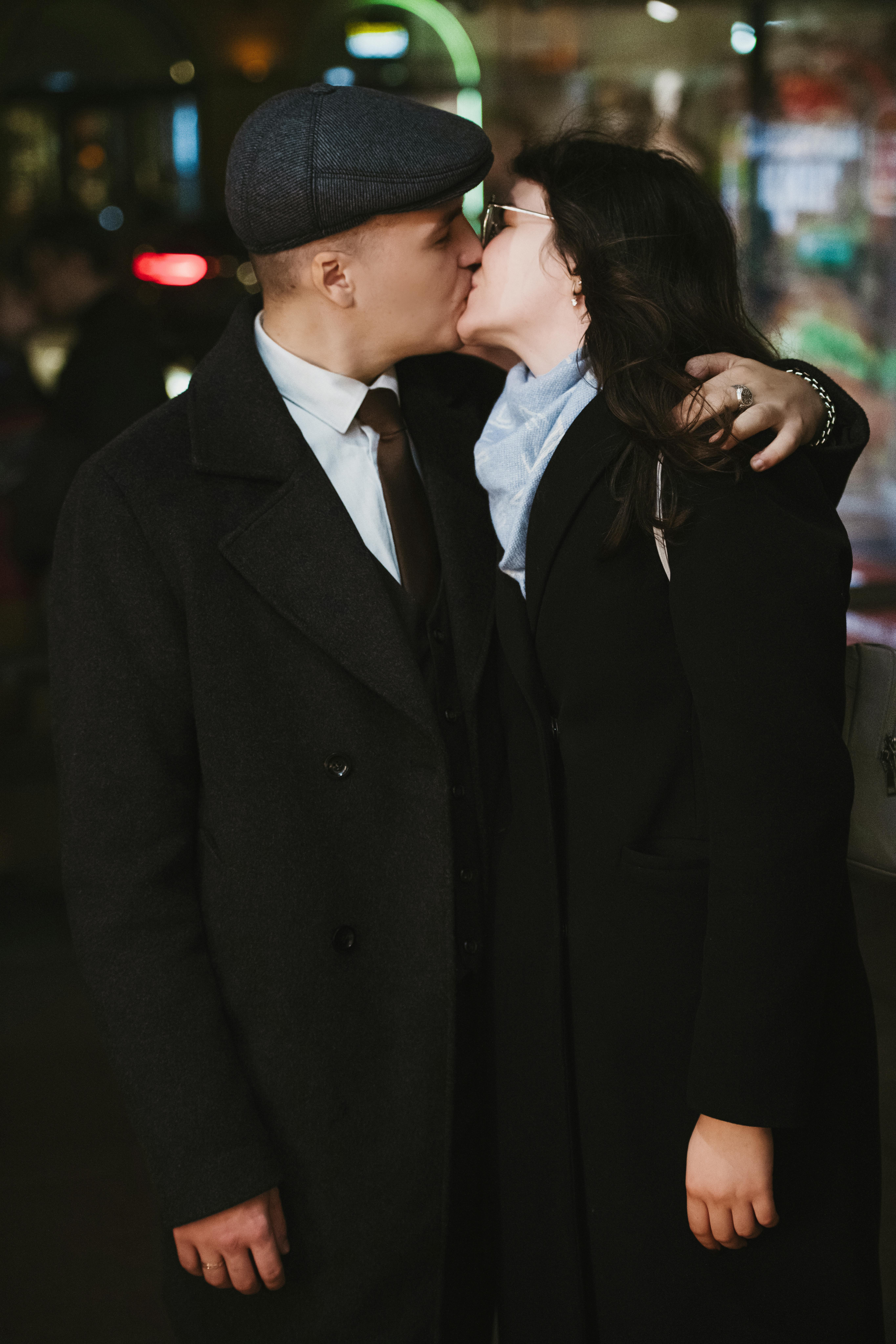 Couple Dressed in Black Suits Kissing · Free Stock Photo