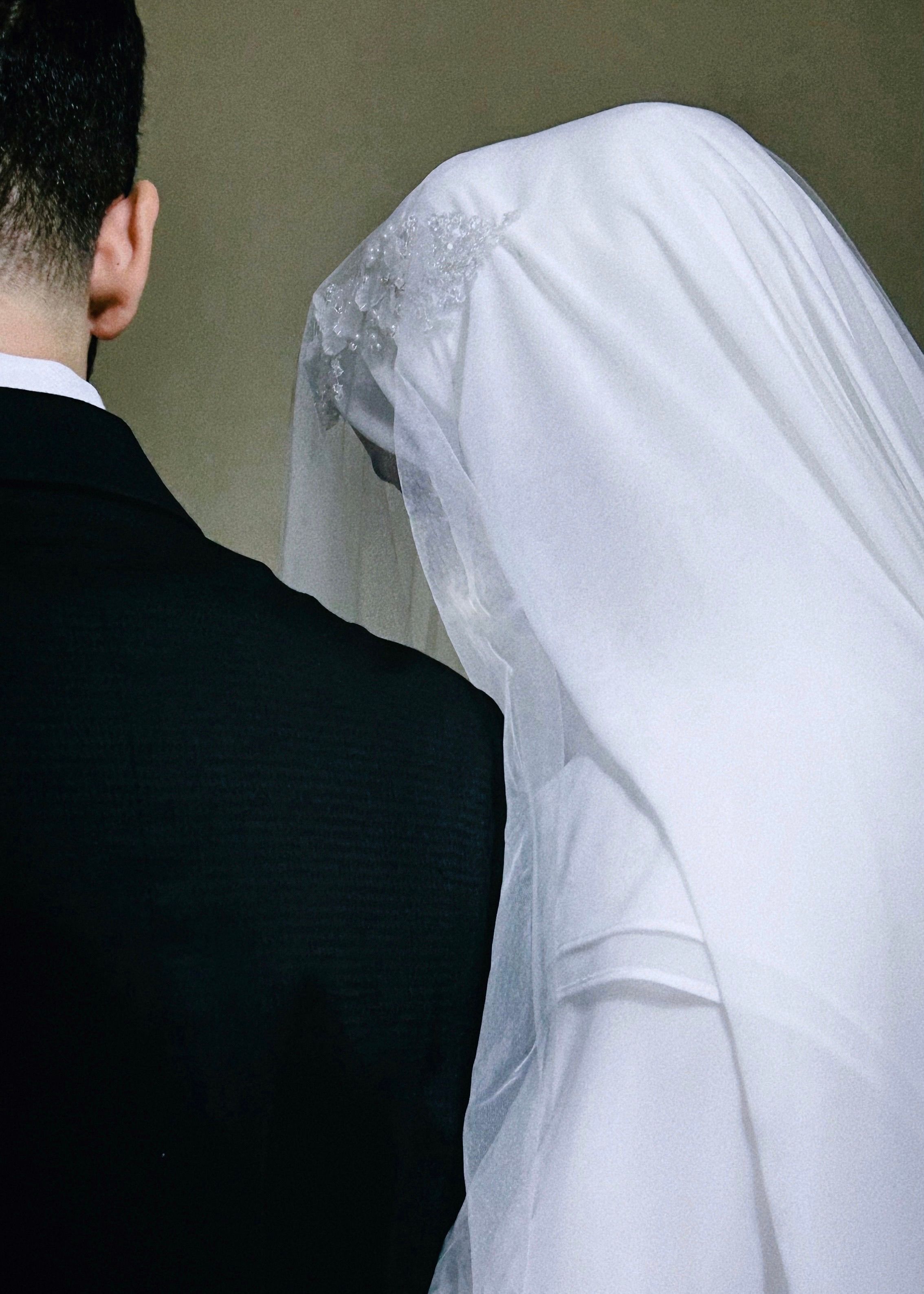 Bride Wearing Veil Next to a Groom · Free Stock Photo