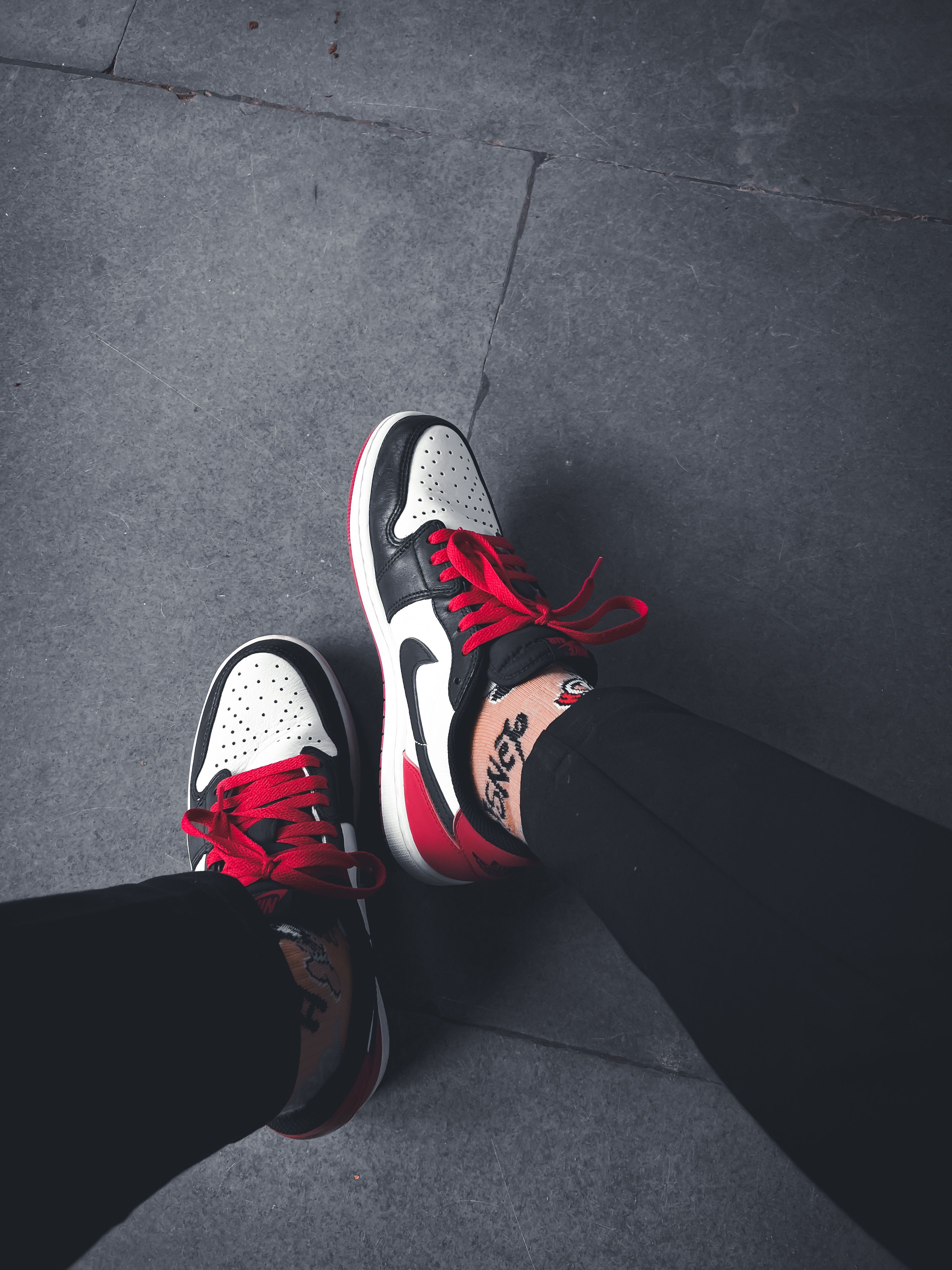 Man in Black Jeans Wearing Pair of Vans Old Skool Sk8-hi · Free Stock Photo