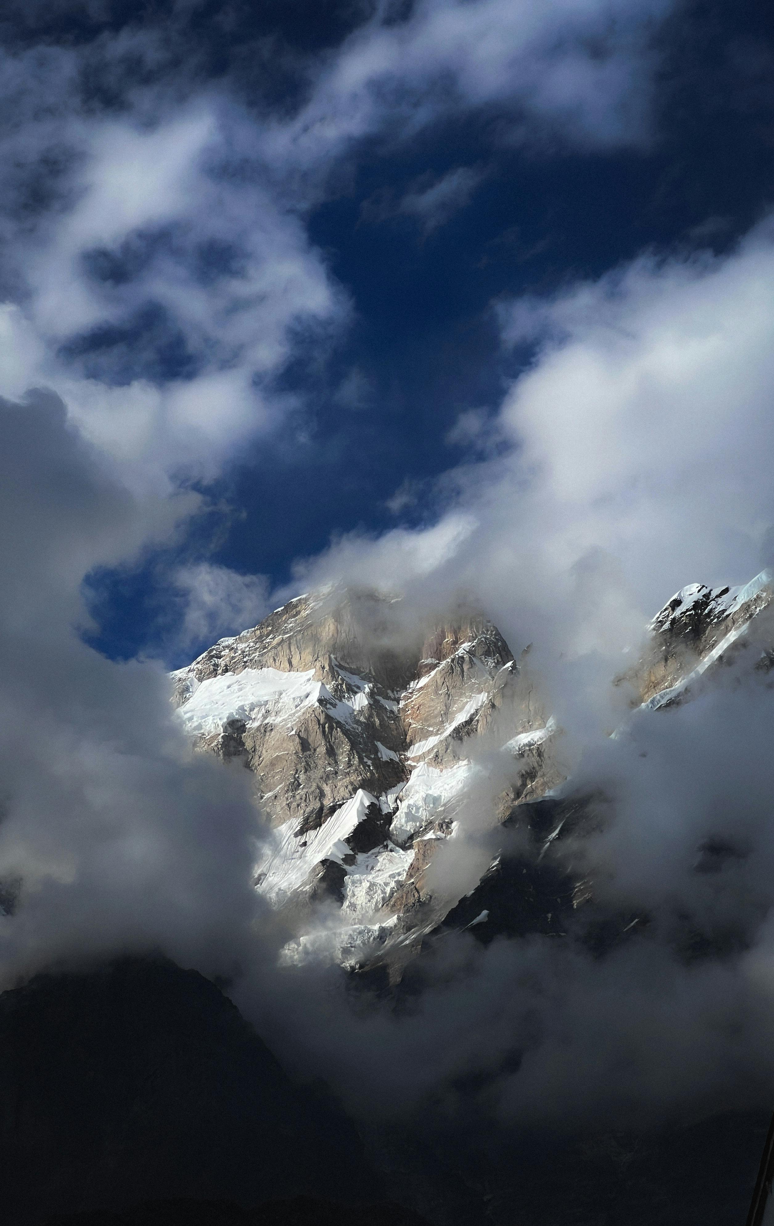 Snow Mountain Peak Seen through Light Clouds · Free Stock Photo