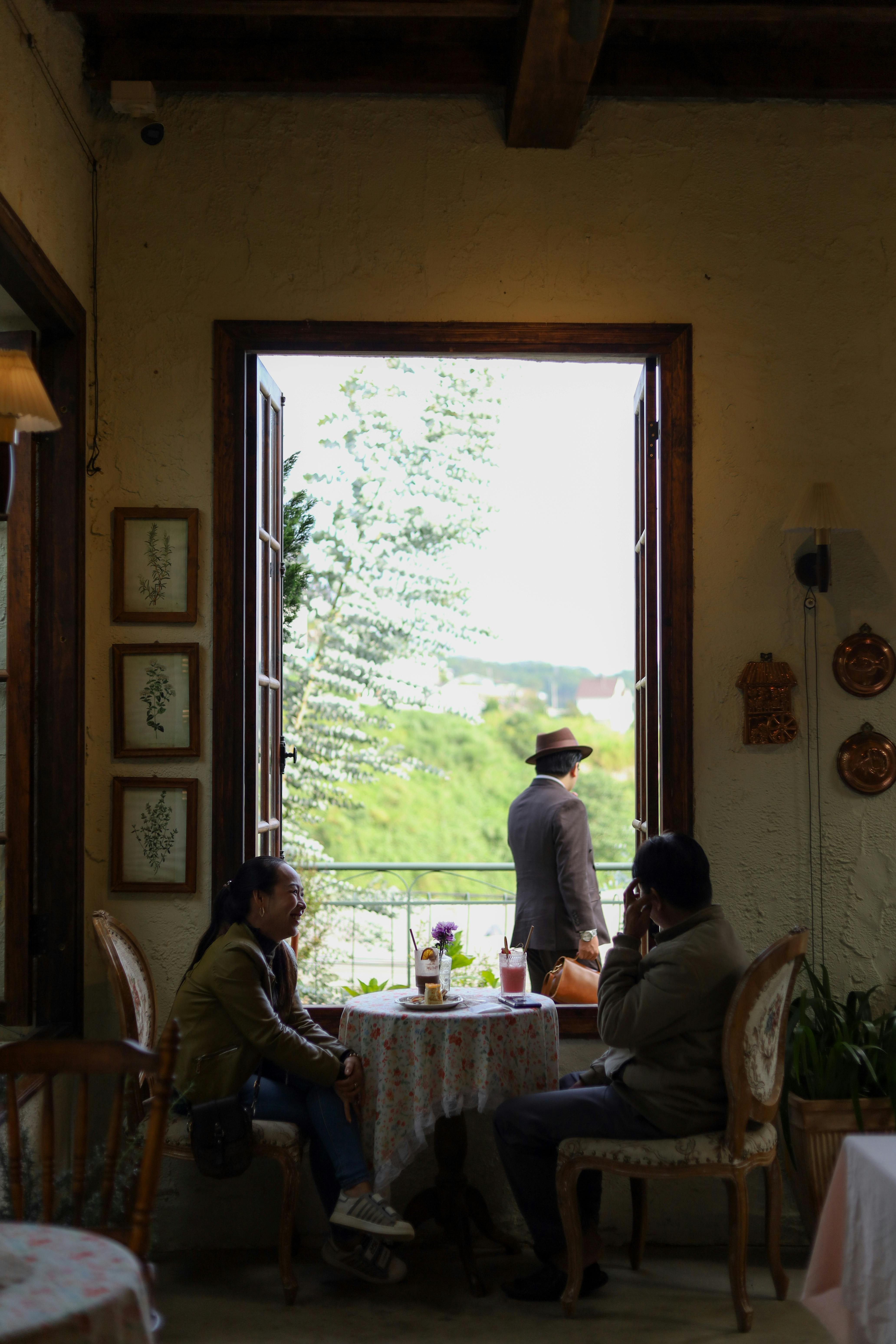 People Sitting by the Window · Free Stock Photo