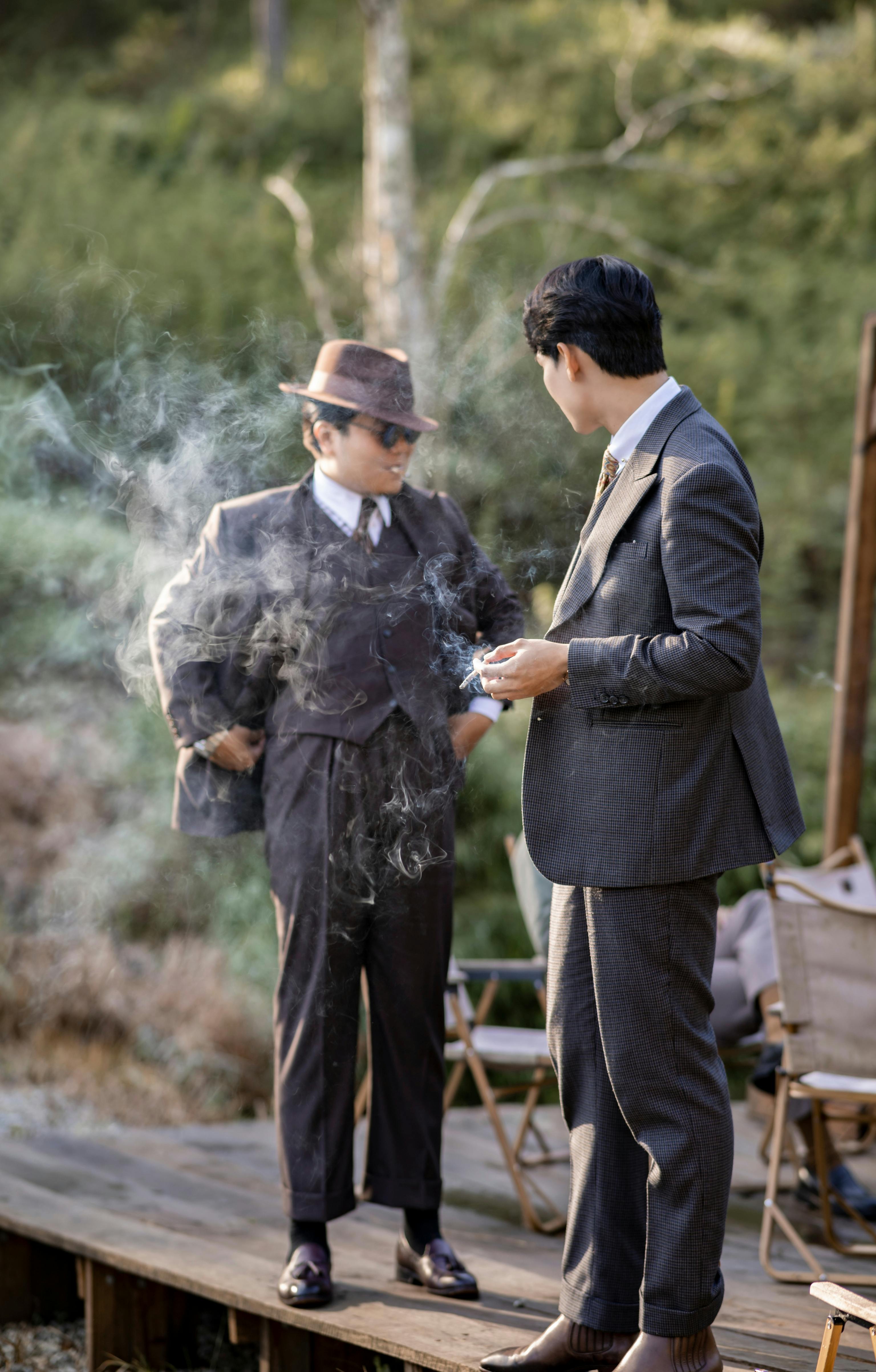 Men in Suits Smoking Cigarettes · Free Stock Photo