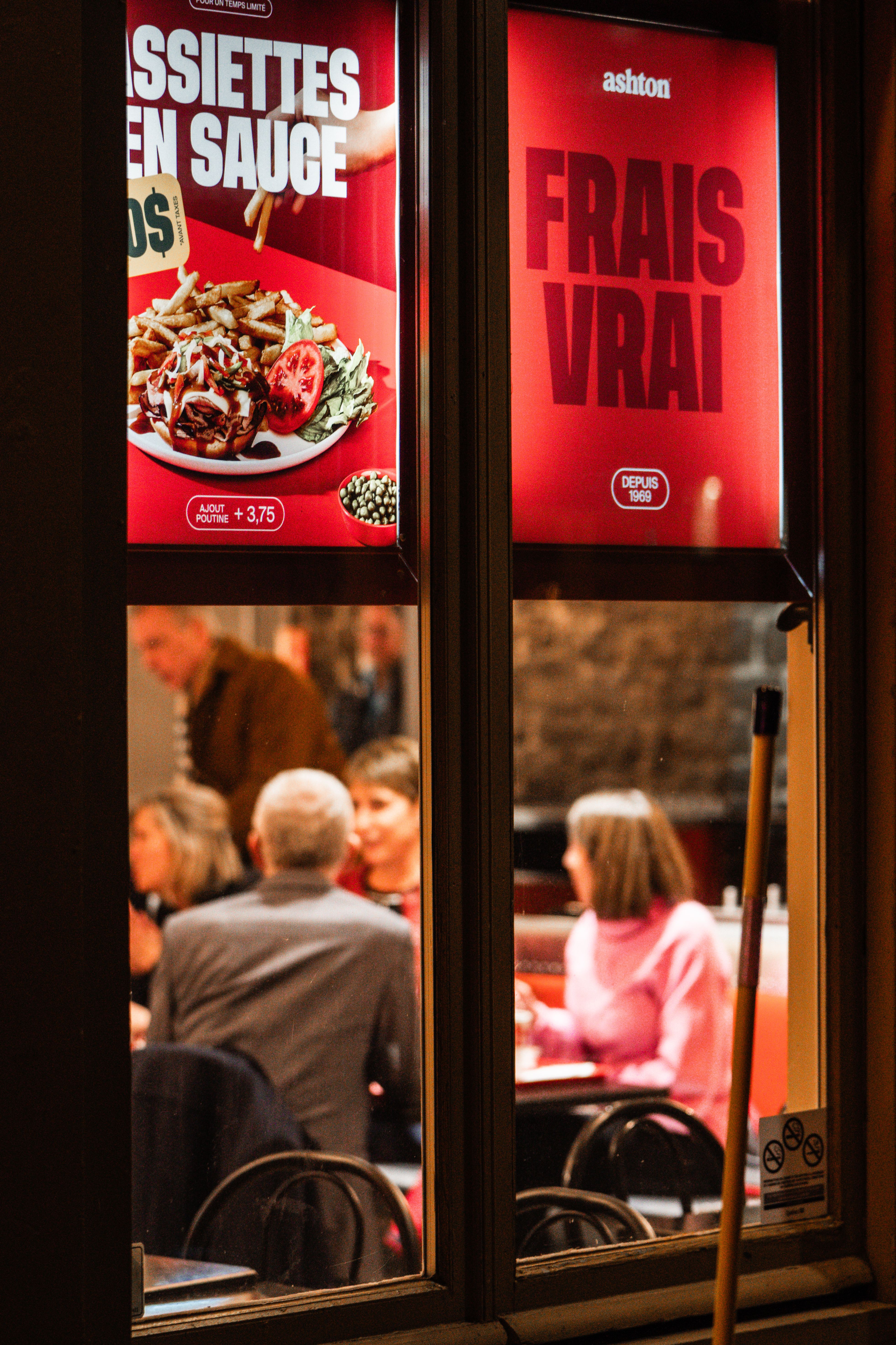 People Sitting Inside a Restaurant Photographed through a Window · Free ...
