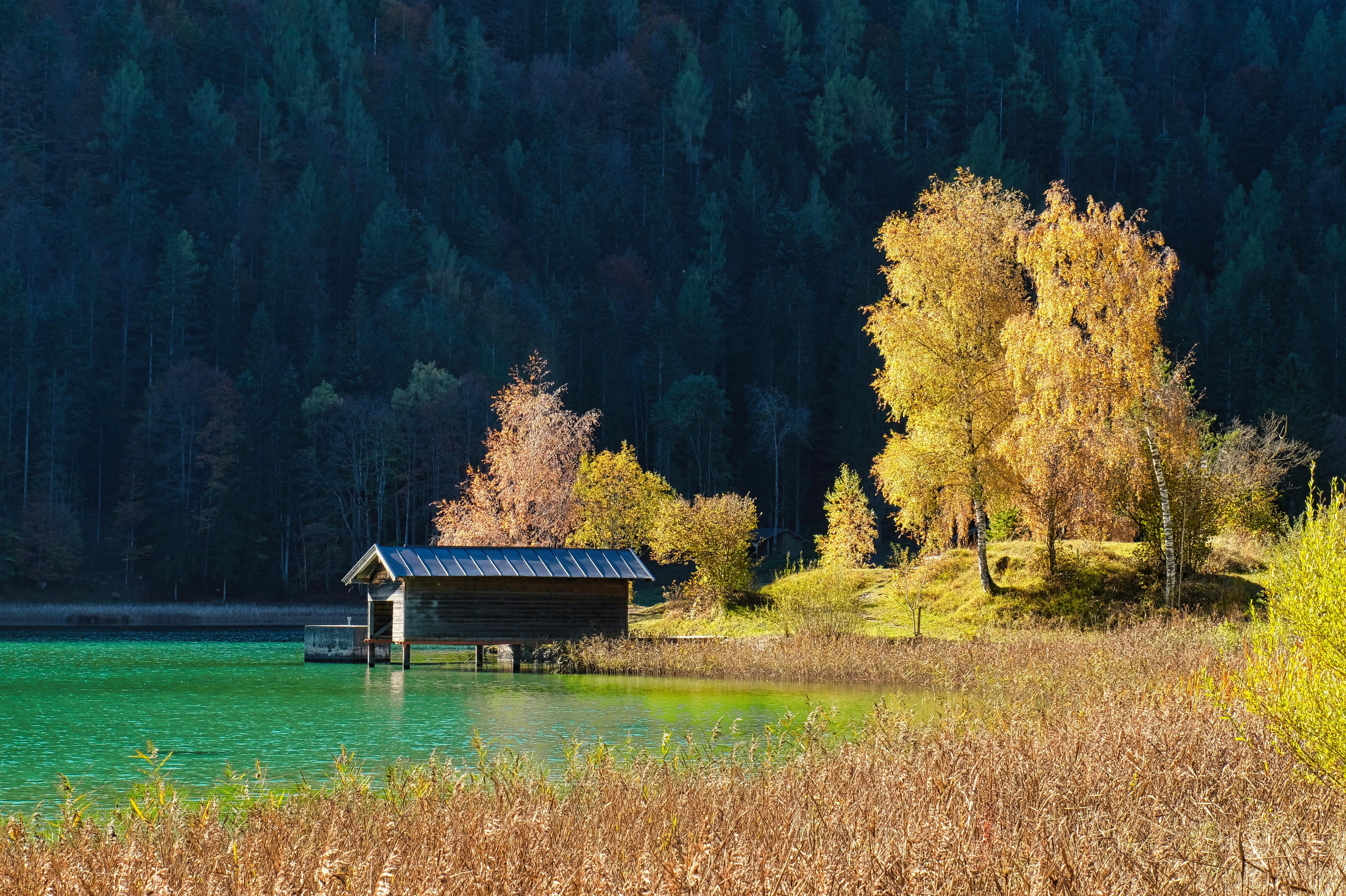 Lakeshore Boathouse in Autumn · Free Stock Photo